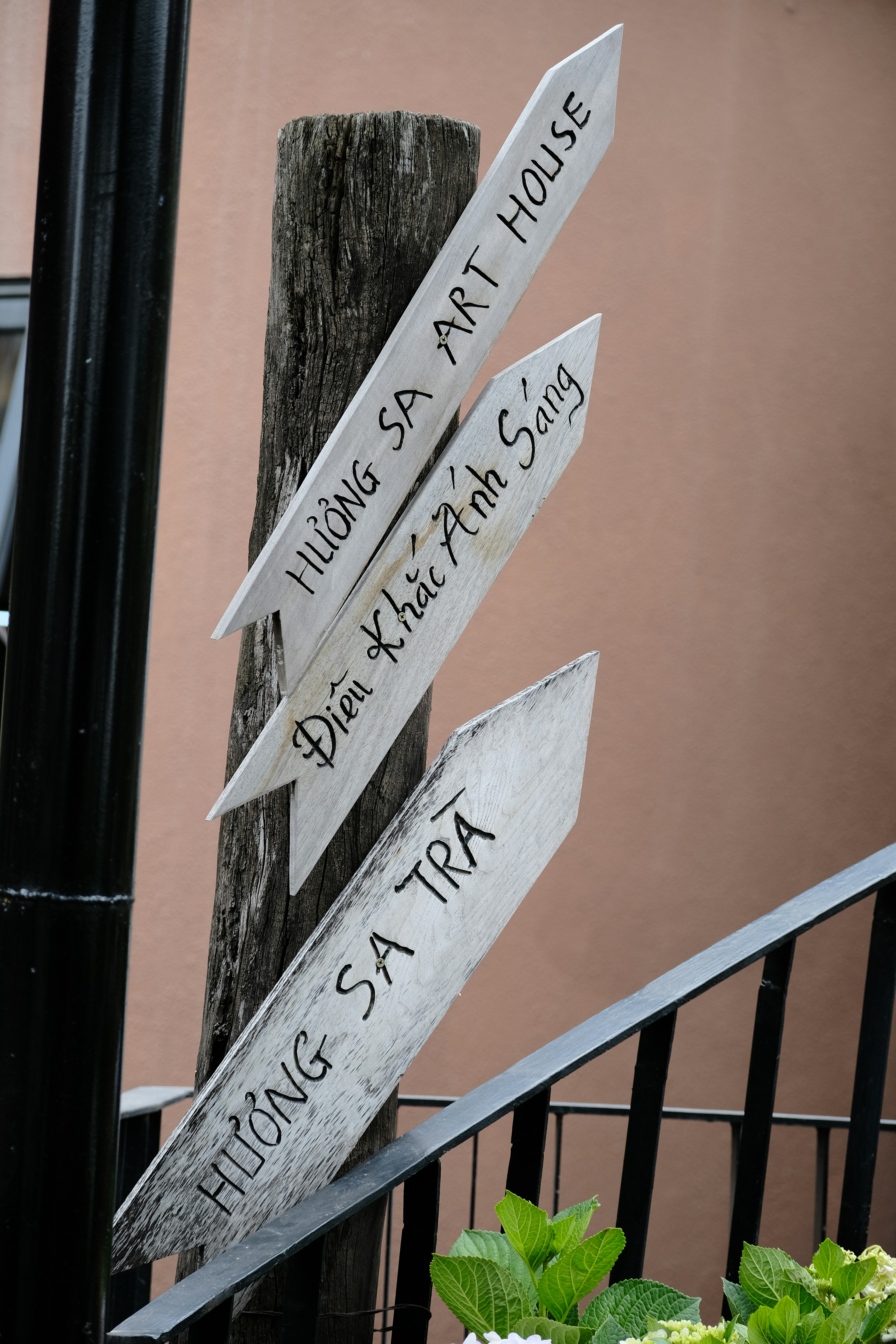 Weathered Arrow Signpost Pointing to Huong Sa Art House