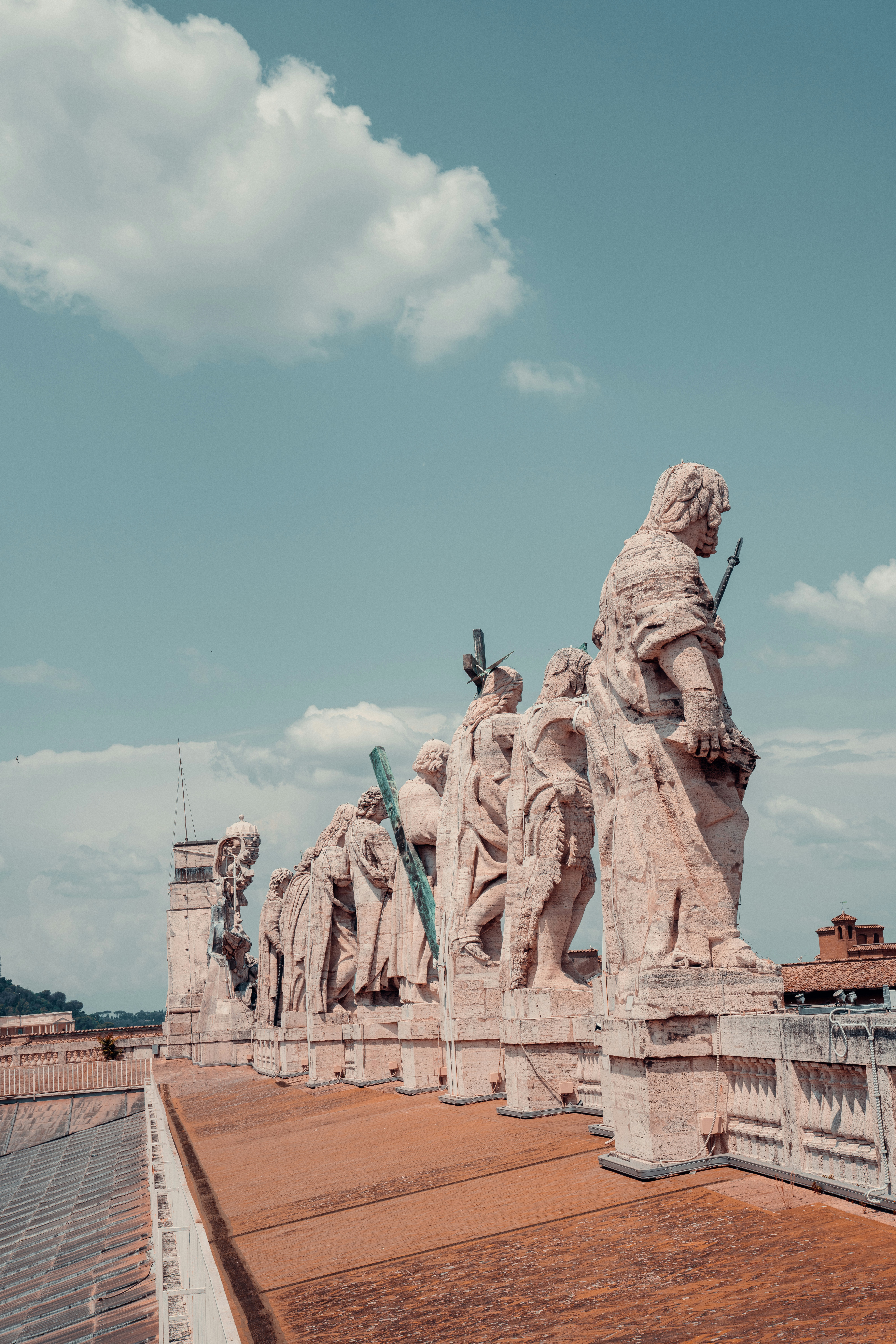 A group of statues sitting on top of a roof photo – Free Vatican city ...