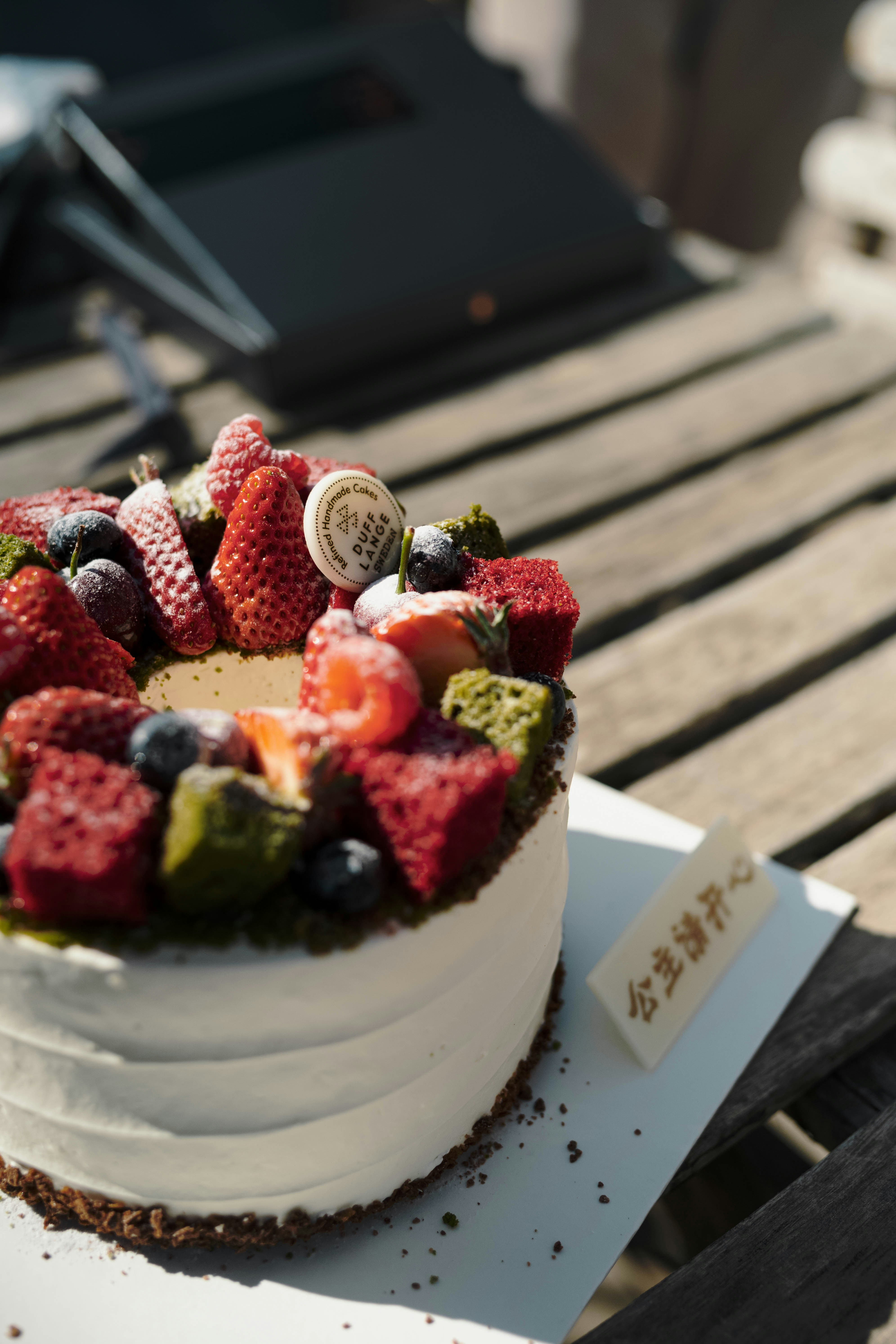 Berry Crowned Cheesecake on a Rustic Table