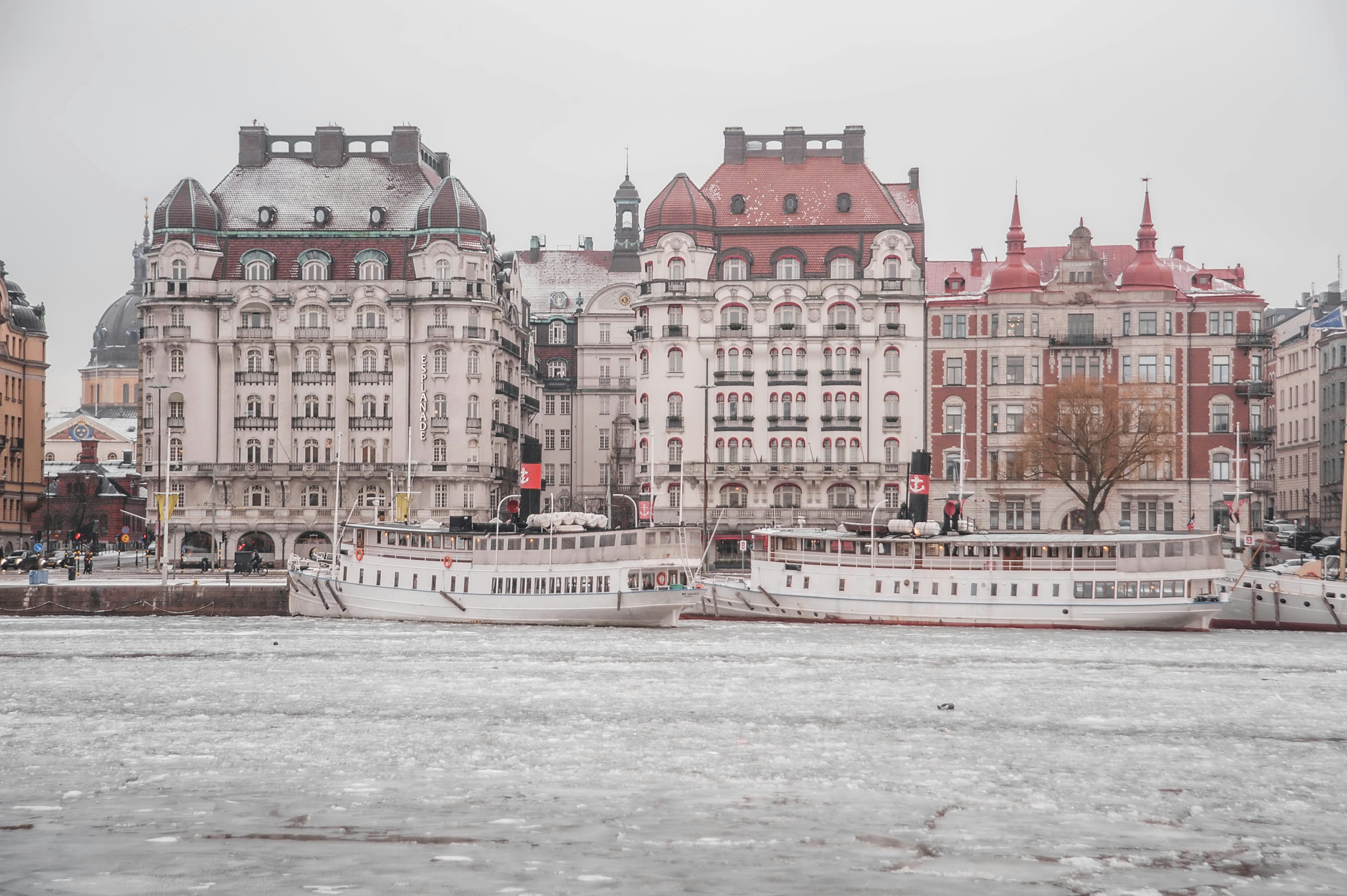 Quayside in Winter Light: Ornate Facades and Idle Boats