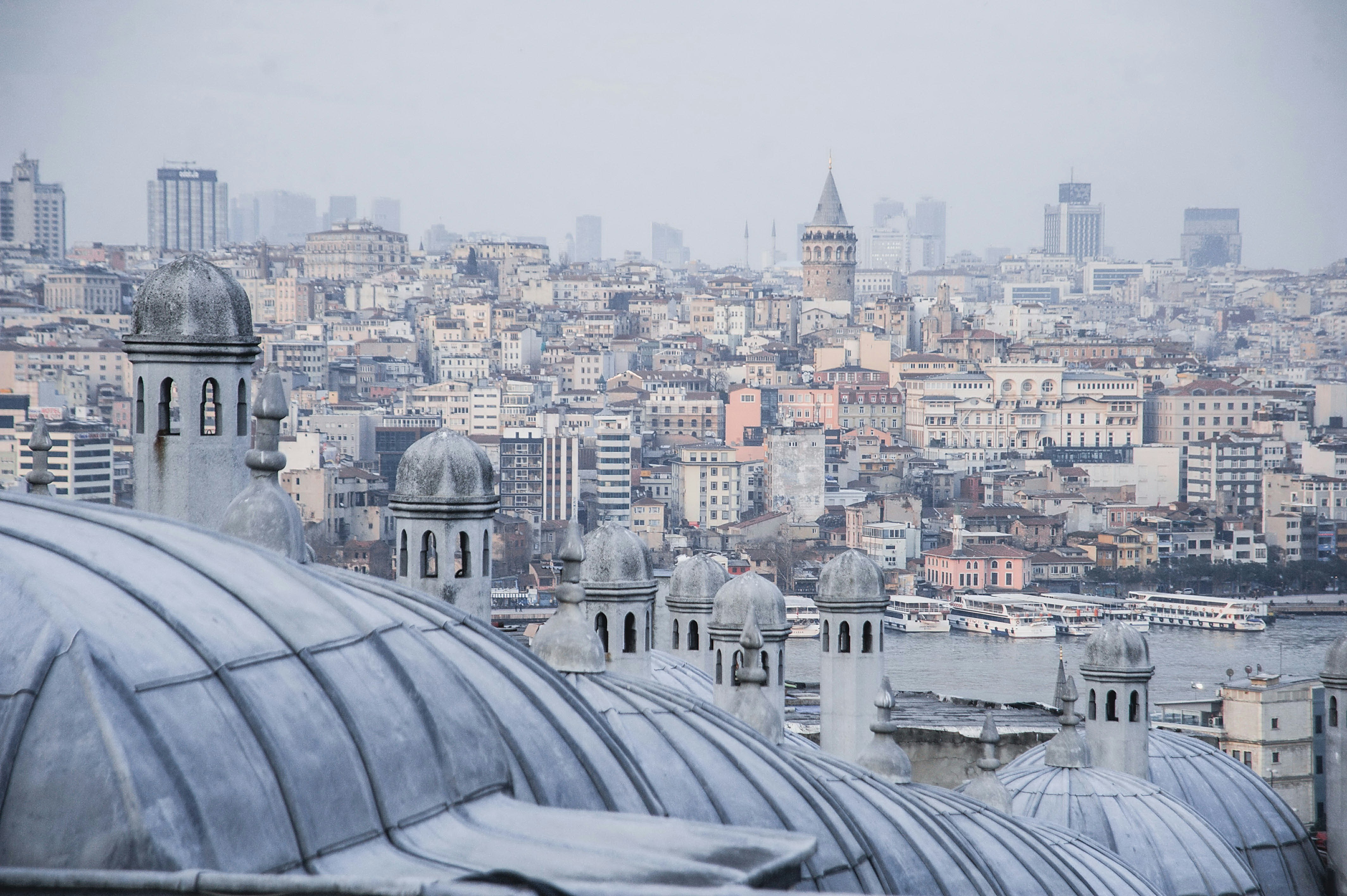 Silver Dome Tapestry Over Istanbul's Waterfront Cityscape