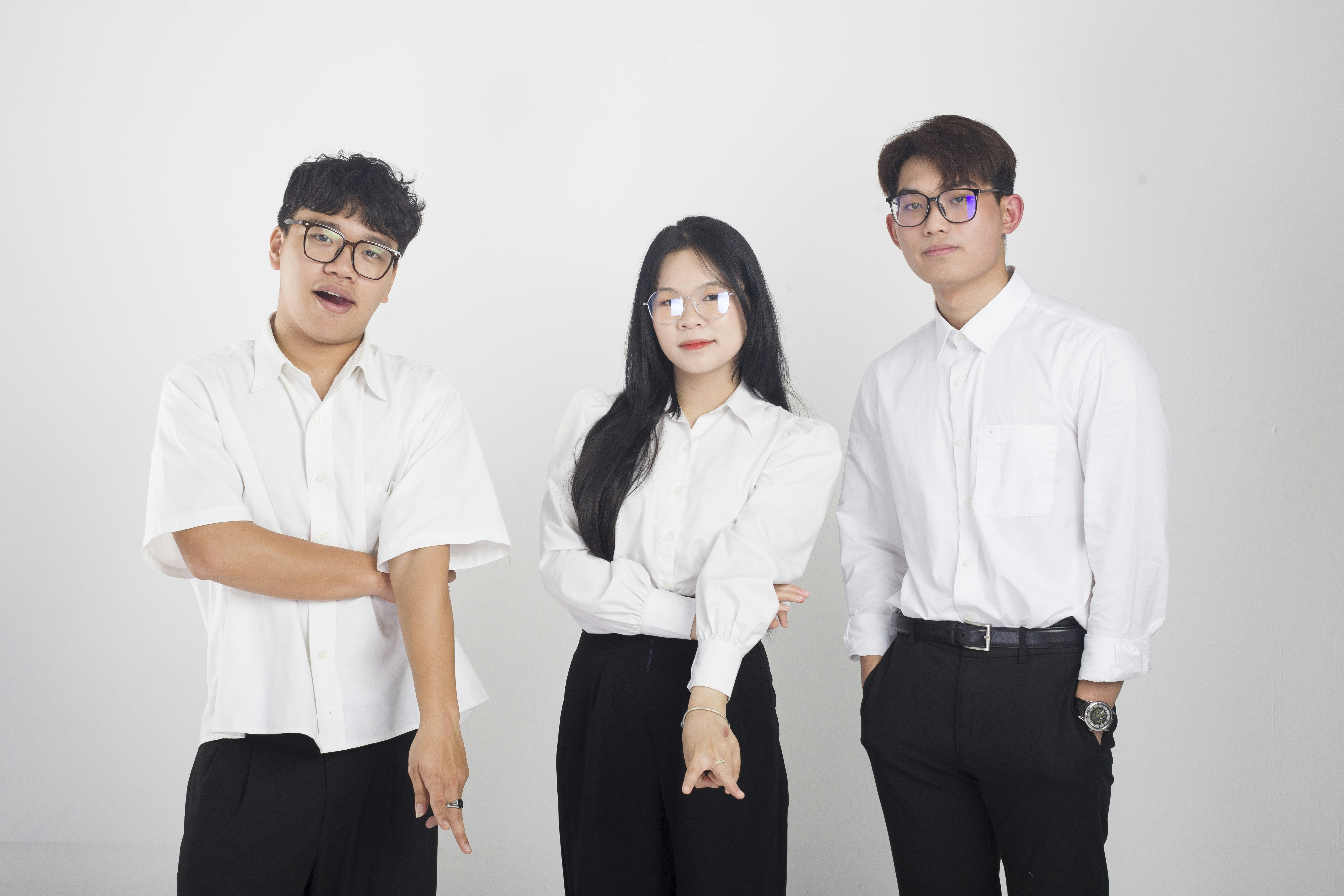 A group of three people standing next to each other photo – Free Shirt ...