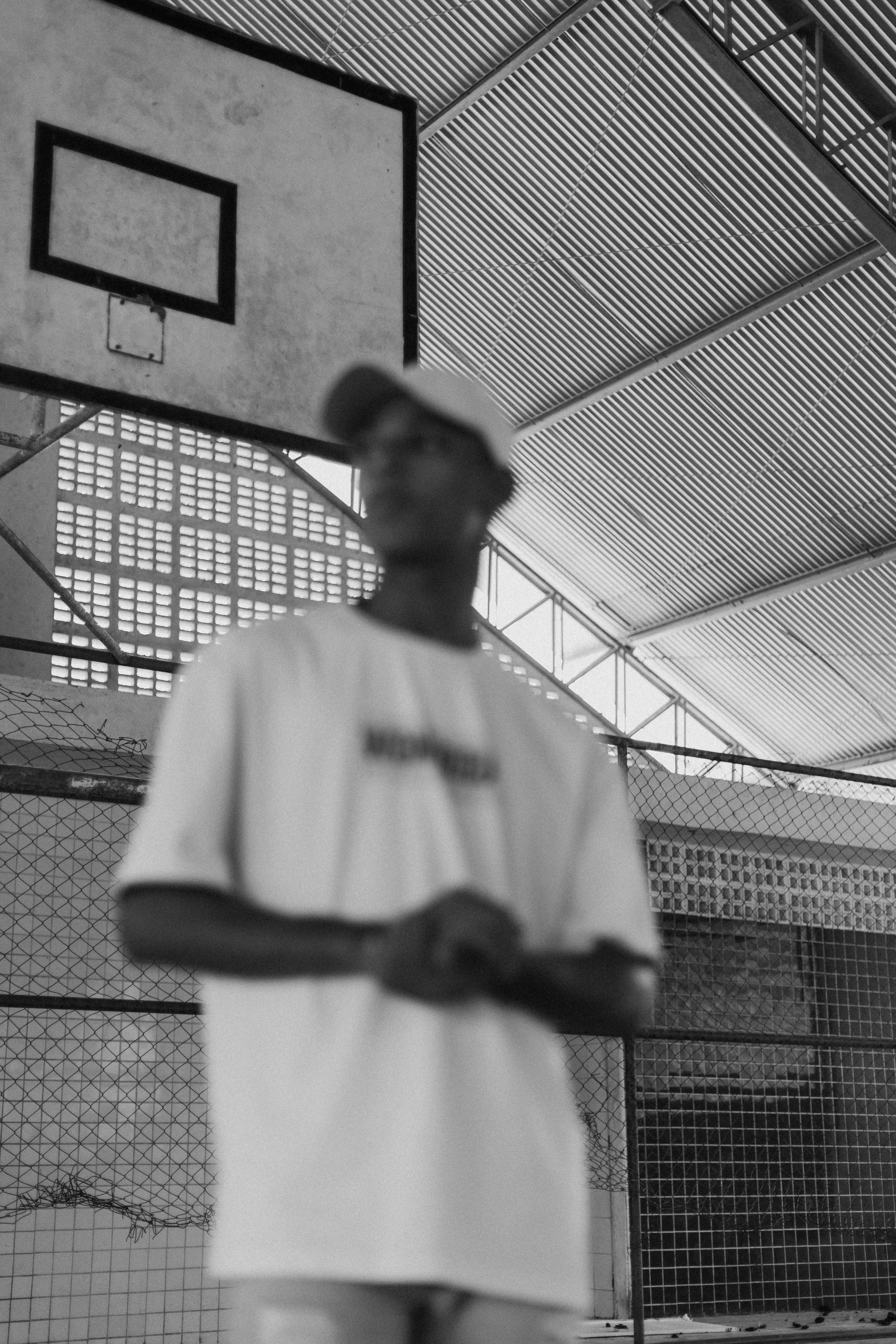 a man standing in front of a basketball hoop