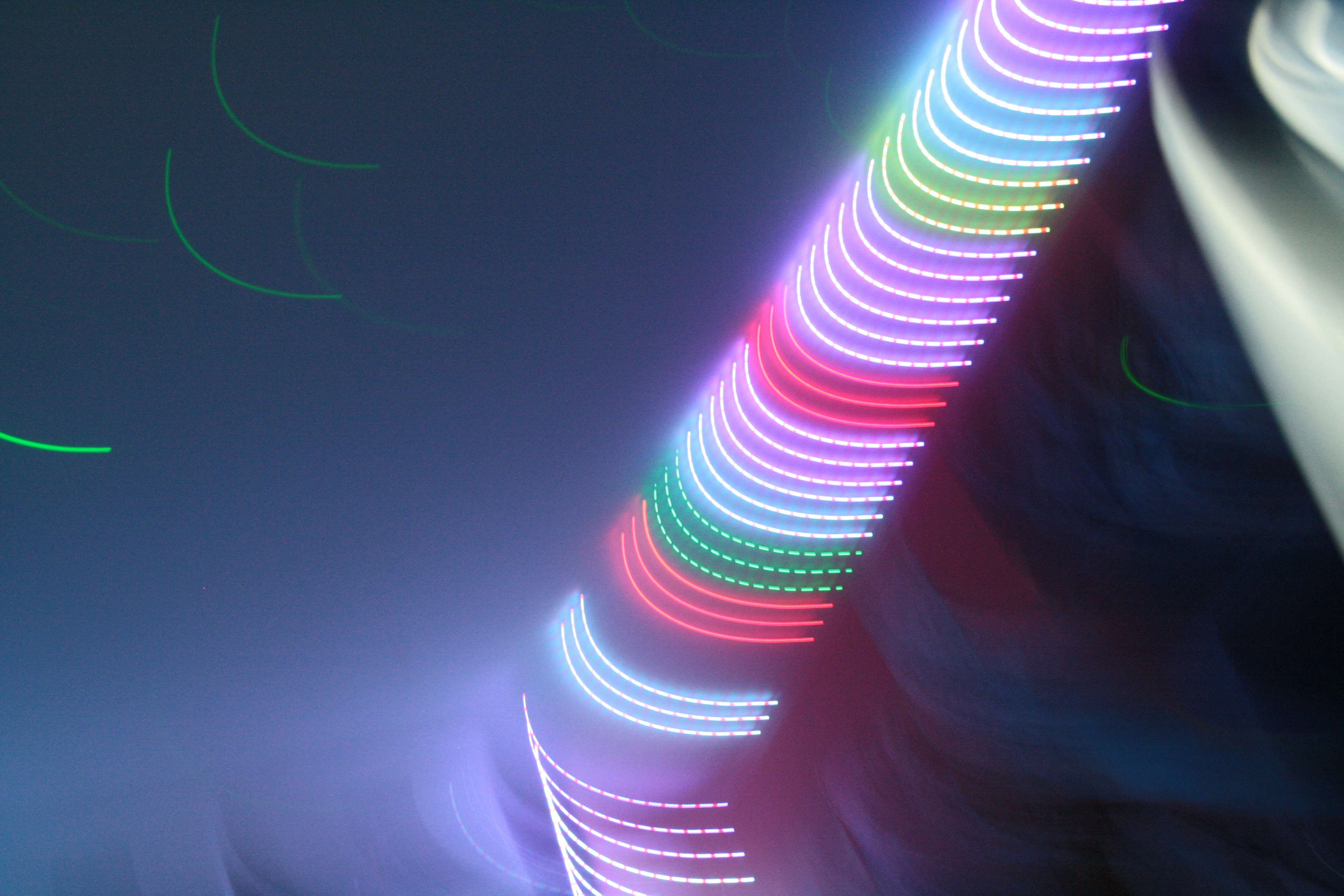 Rainbow Helix in Motion: A Long-Exposure Neon Sculpture