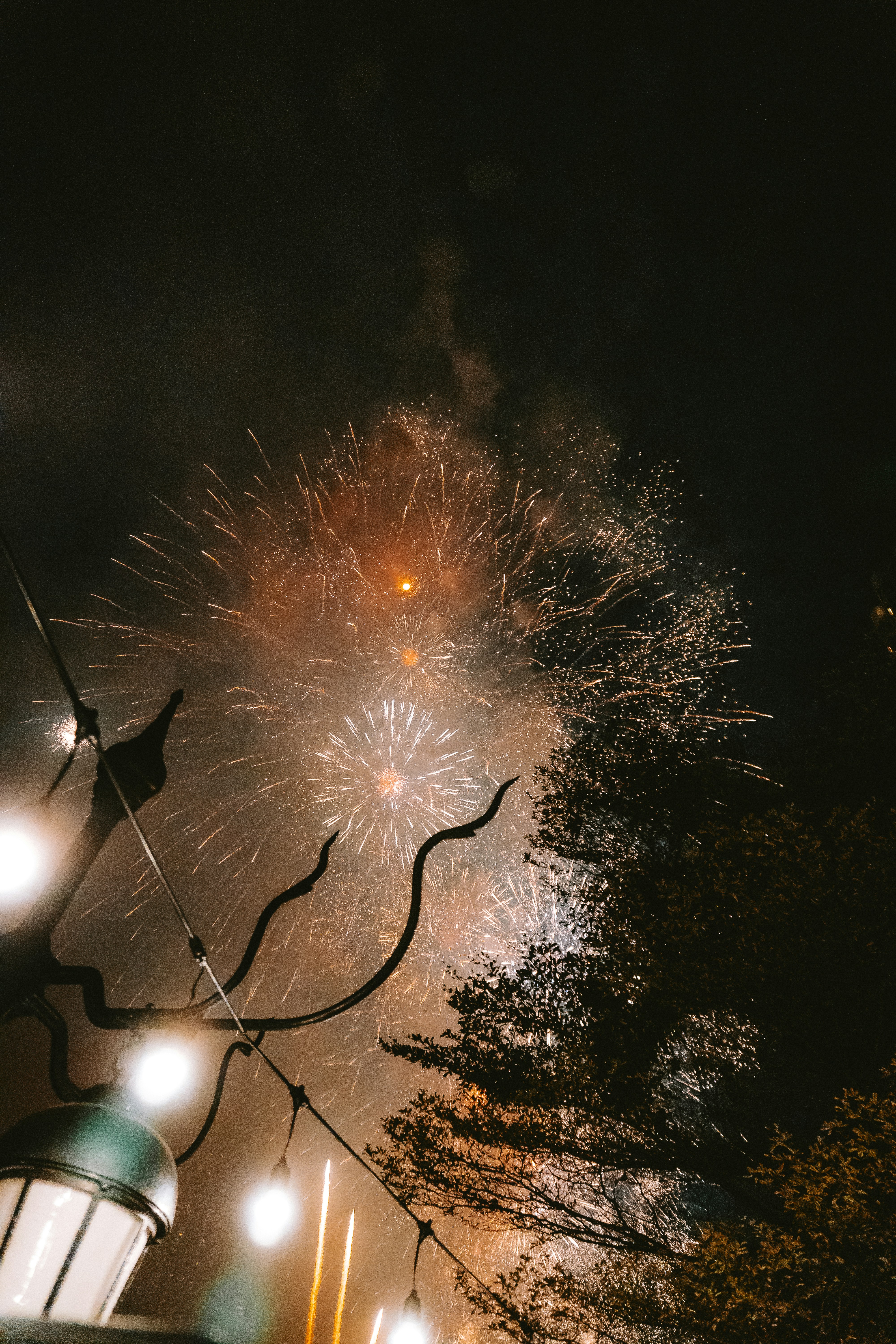 Firework Crown Over a Lantern-lit Street