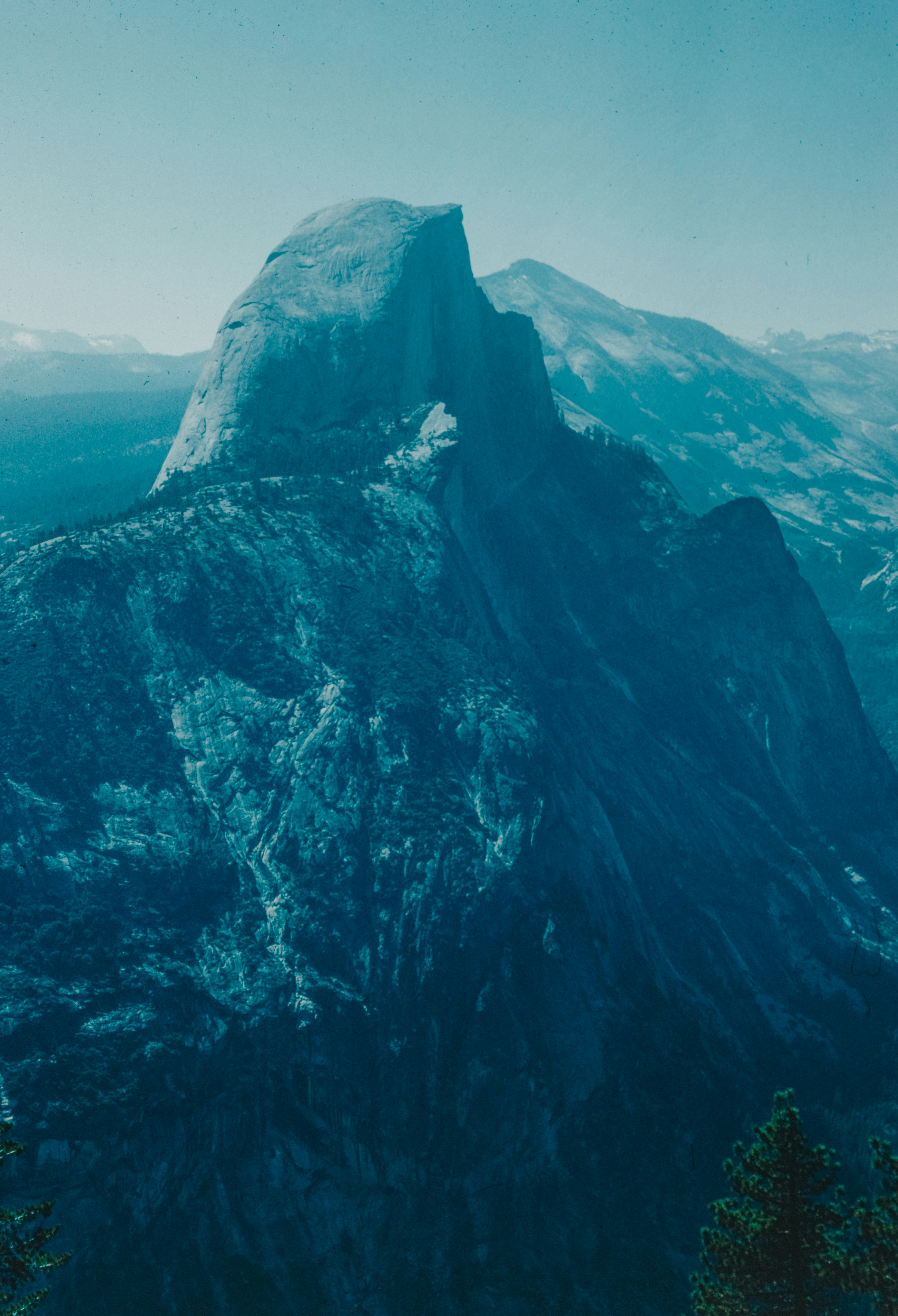 A very tall mountain with a very big rock on top of it photo – Free ...