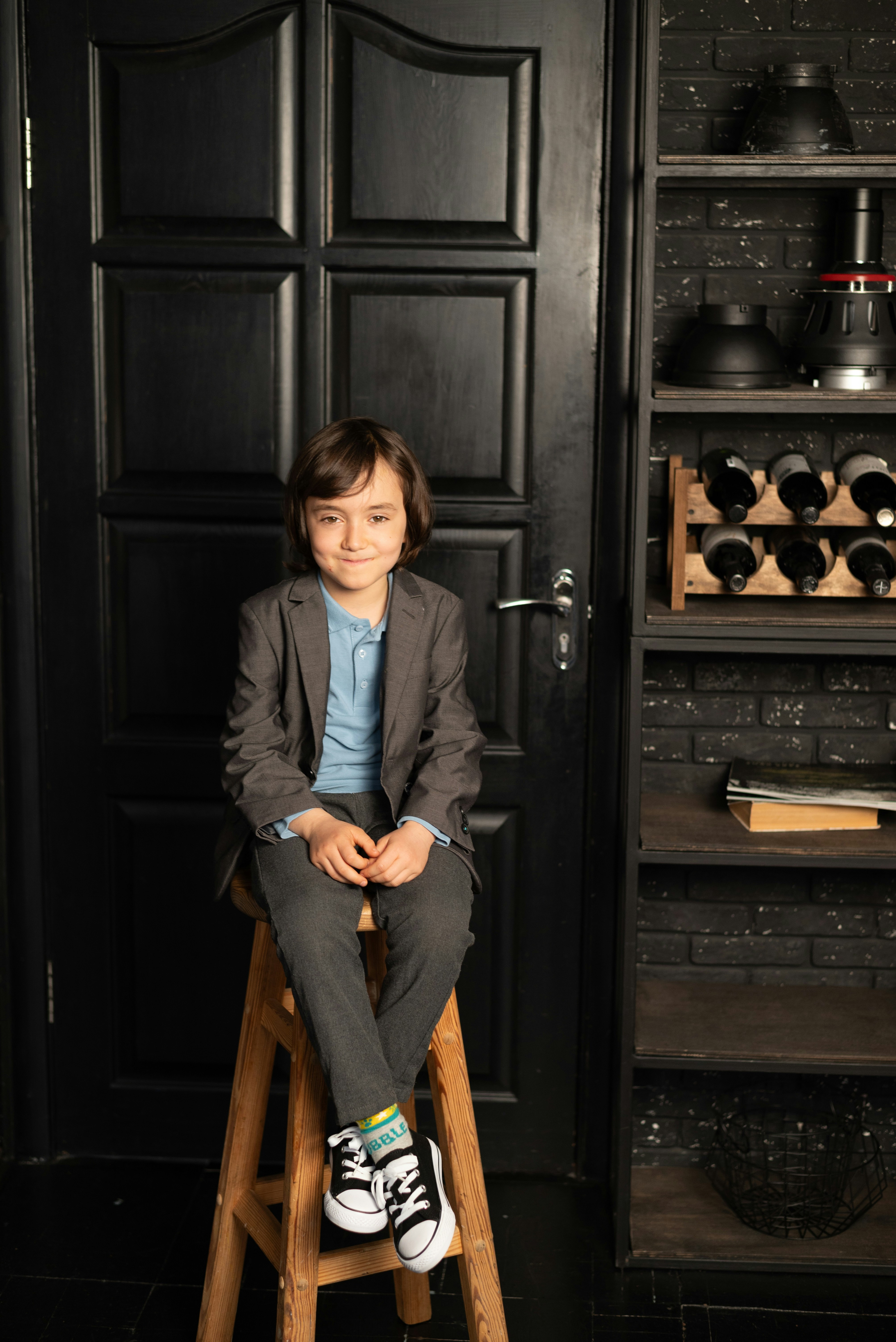 Portrait in a Quiet Study: a Young Student Seated on a Stool