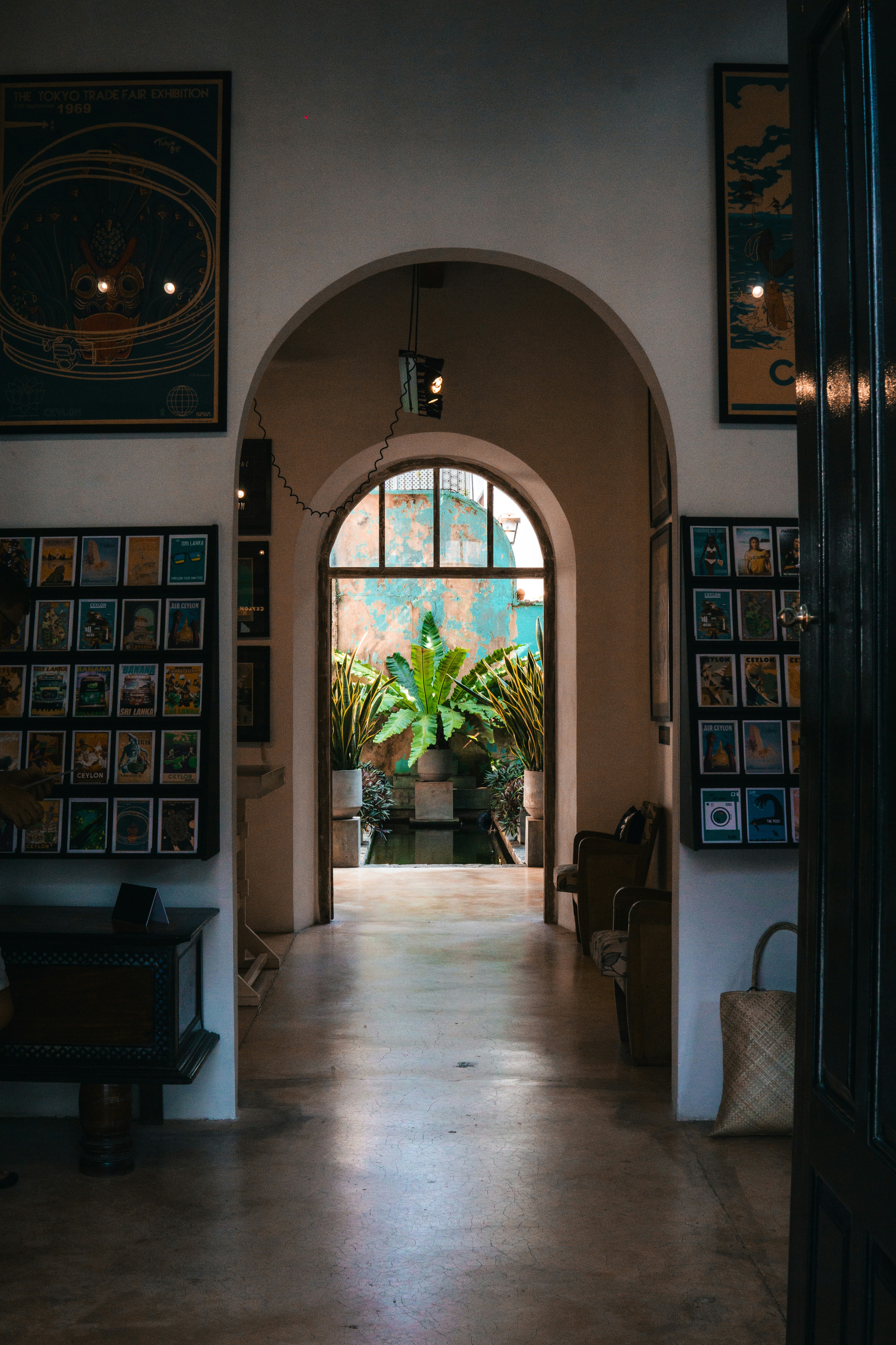 Archway to a Quiet Oasis: A Sunlit Courtyard Framed by Gallery Walls