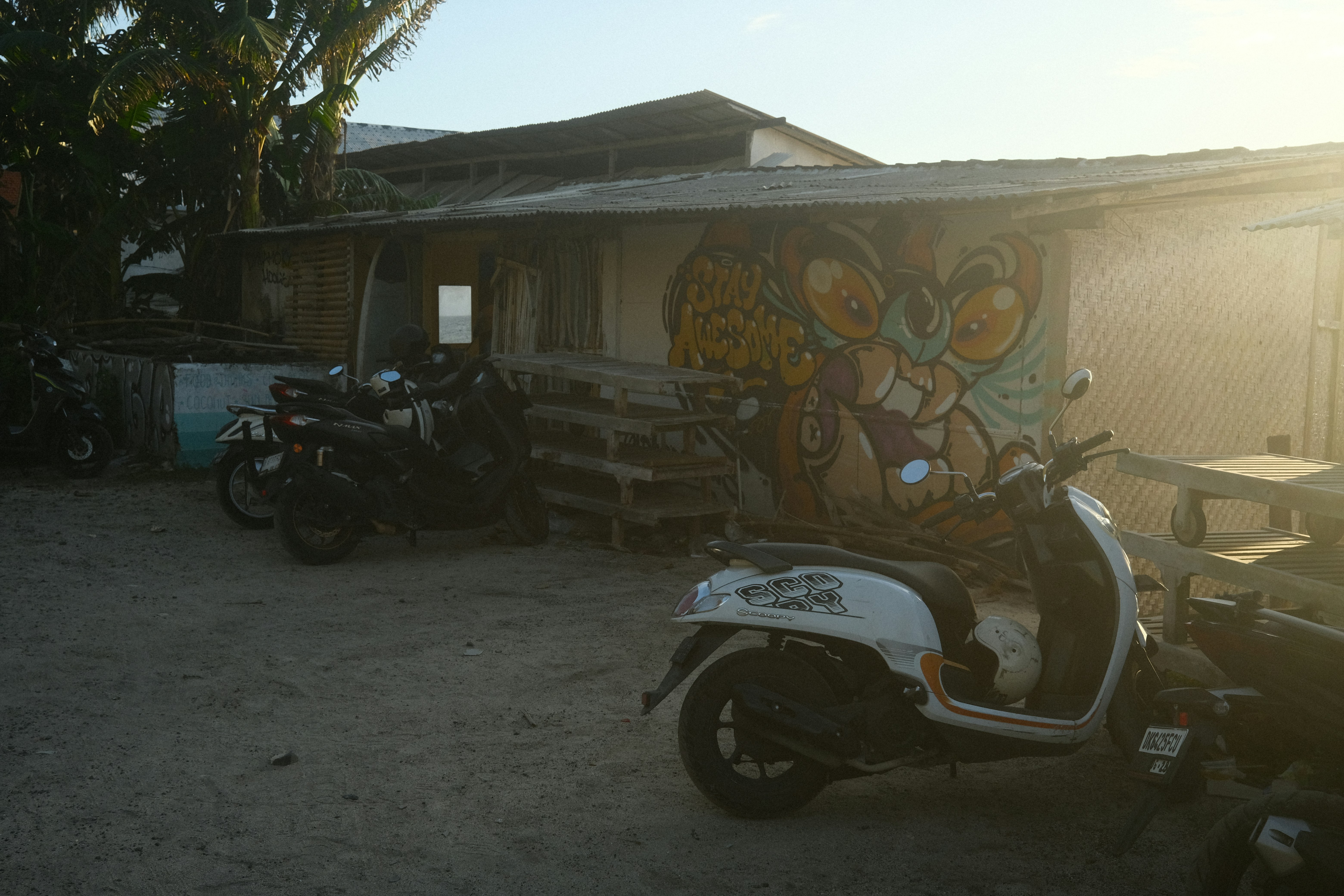Scooter by Graffiti Wall at Sunset: Quiet Yard in Velvet Light