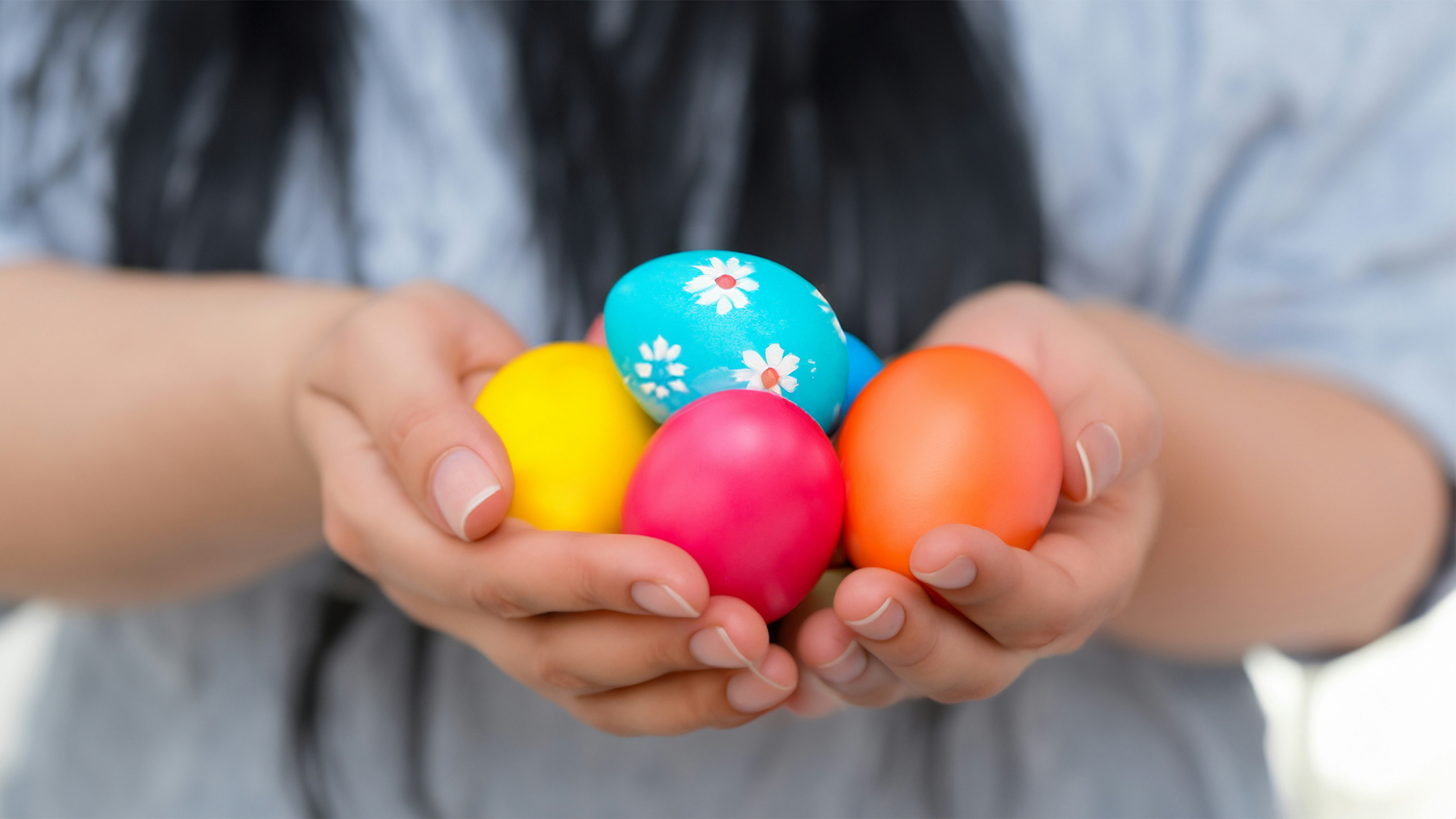 A person holding three colorful eggs in their hands photo – Free ...