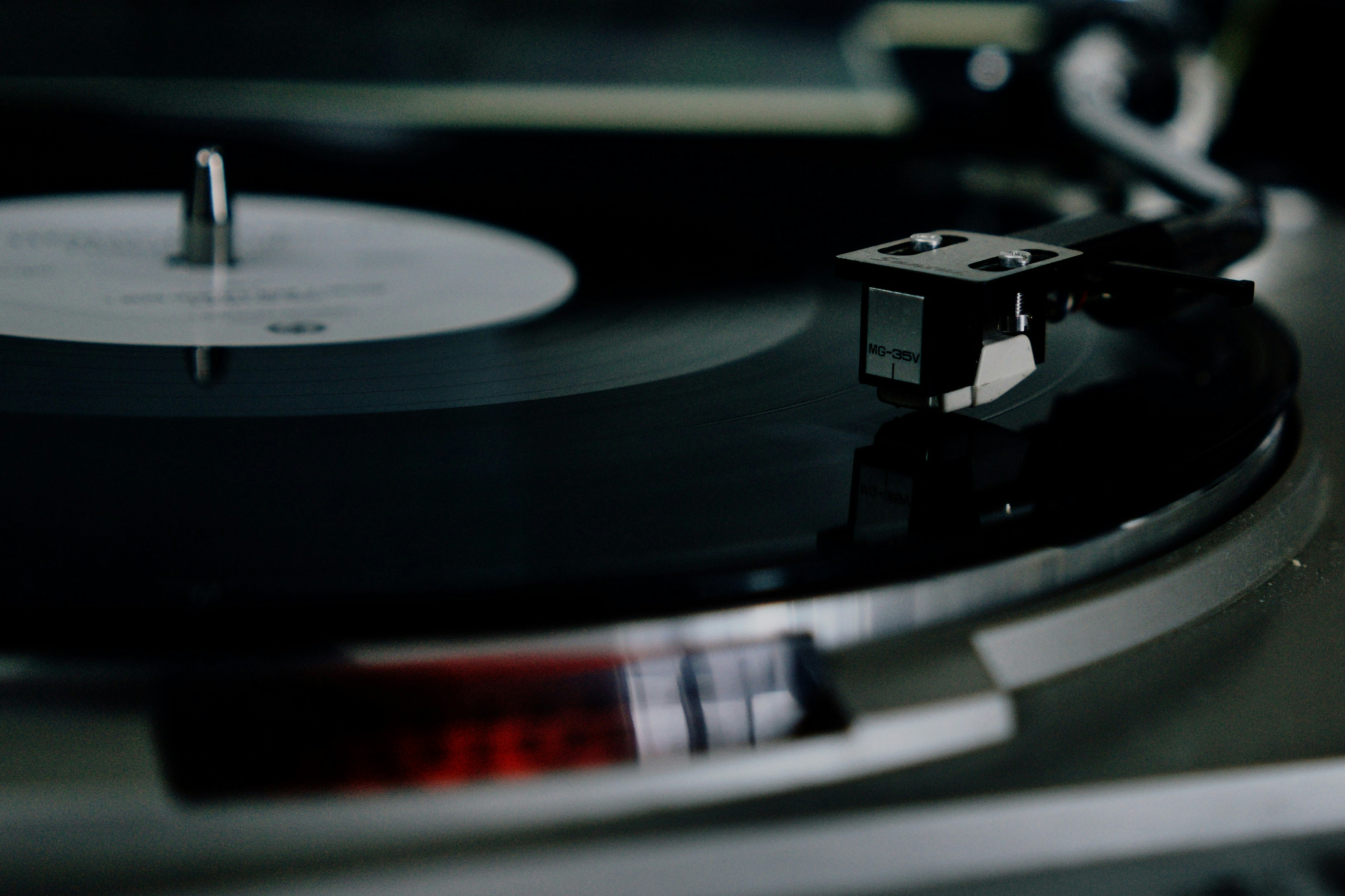 A turntable with a record player in the background photo – Free ...