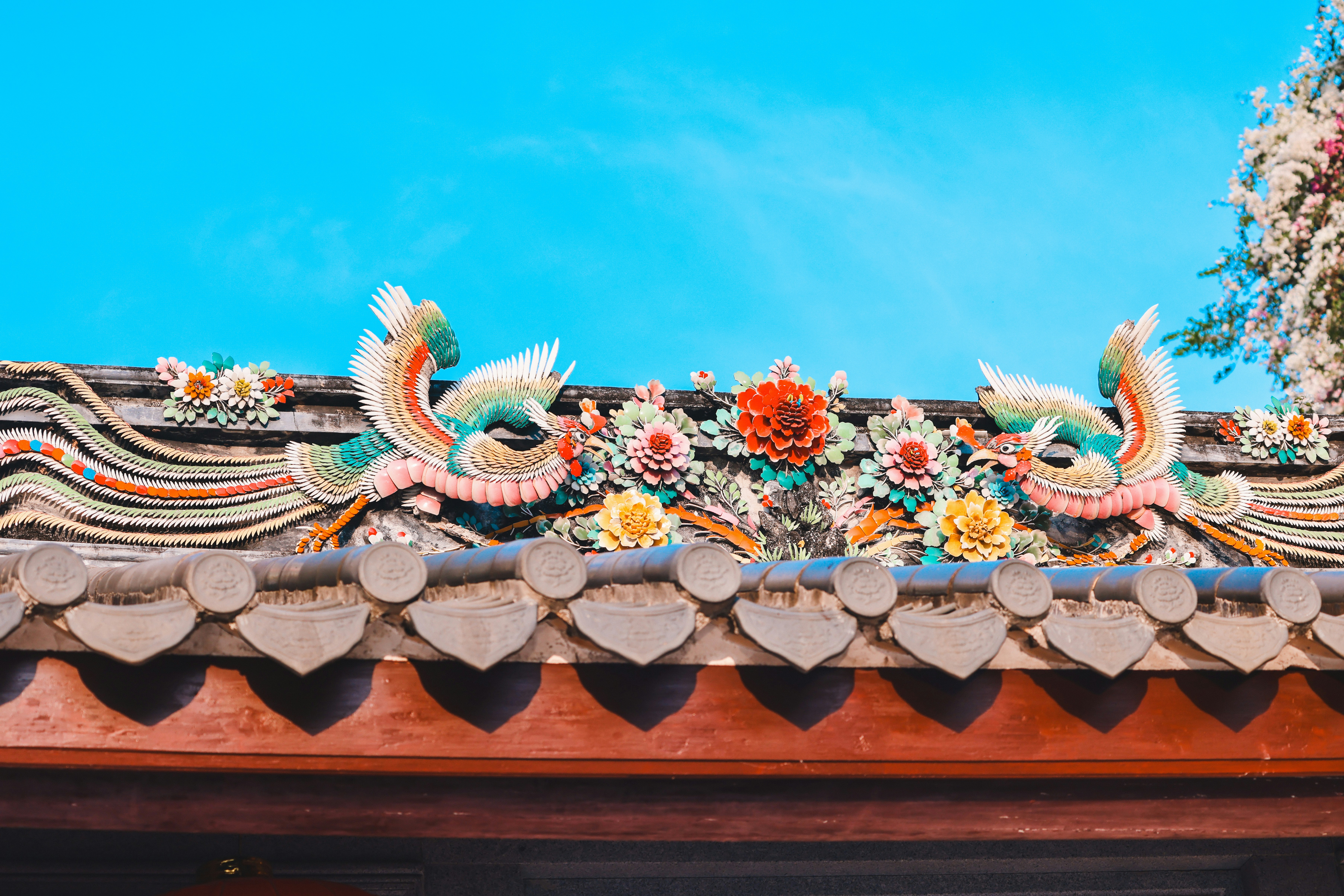 Dragon-Tail Roof Ornaments Against Cerulean Sky