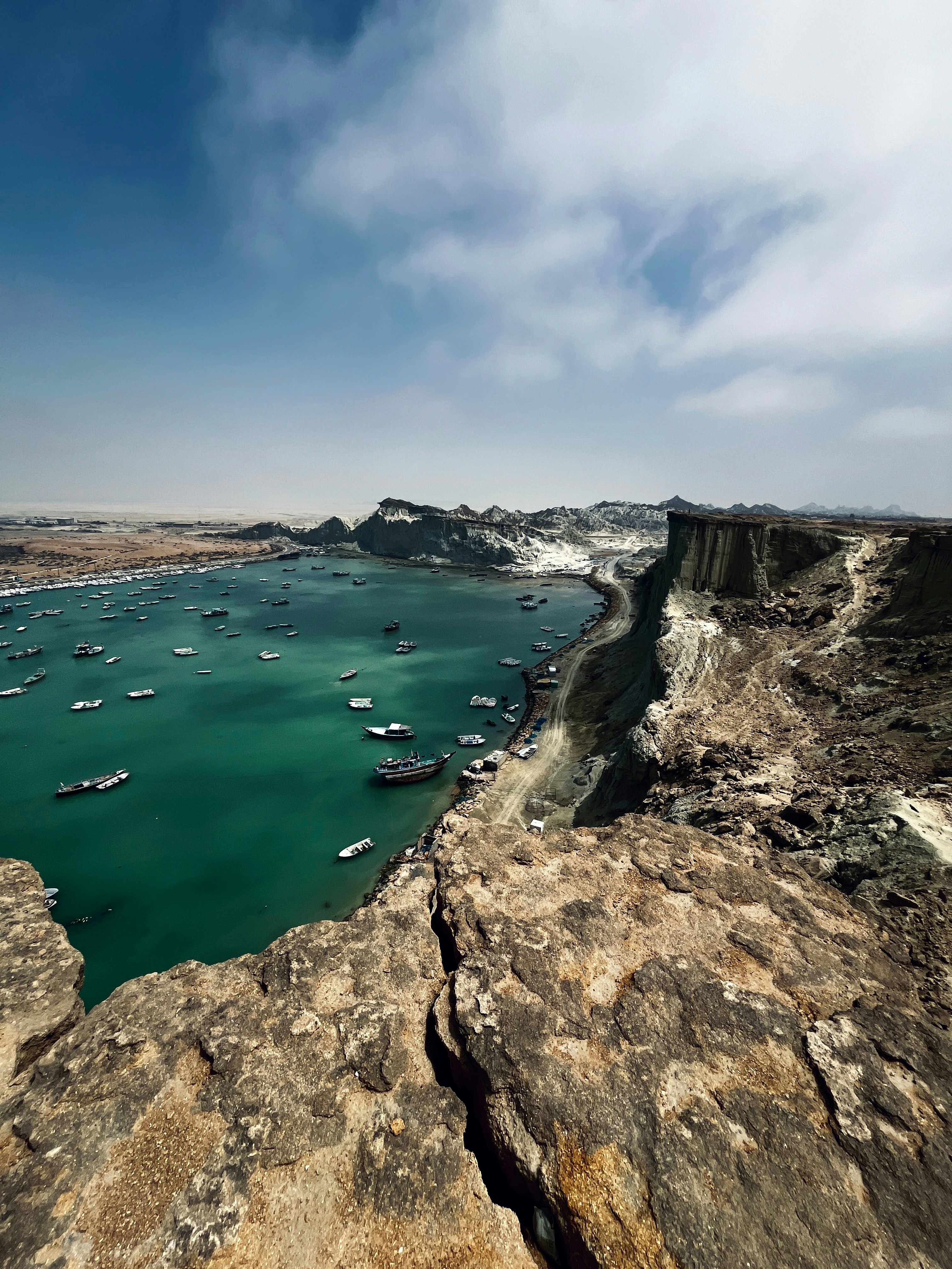 Teal Inlet: Boats Nestle Along a Cliff-Guarded Cove