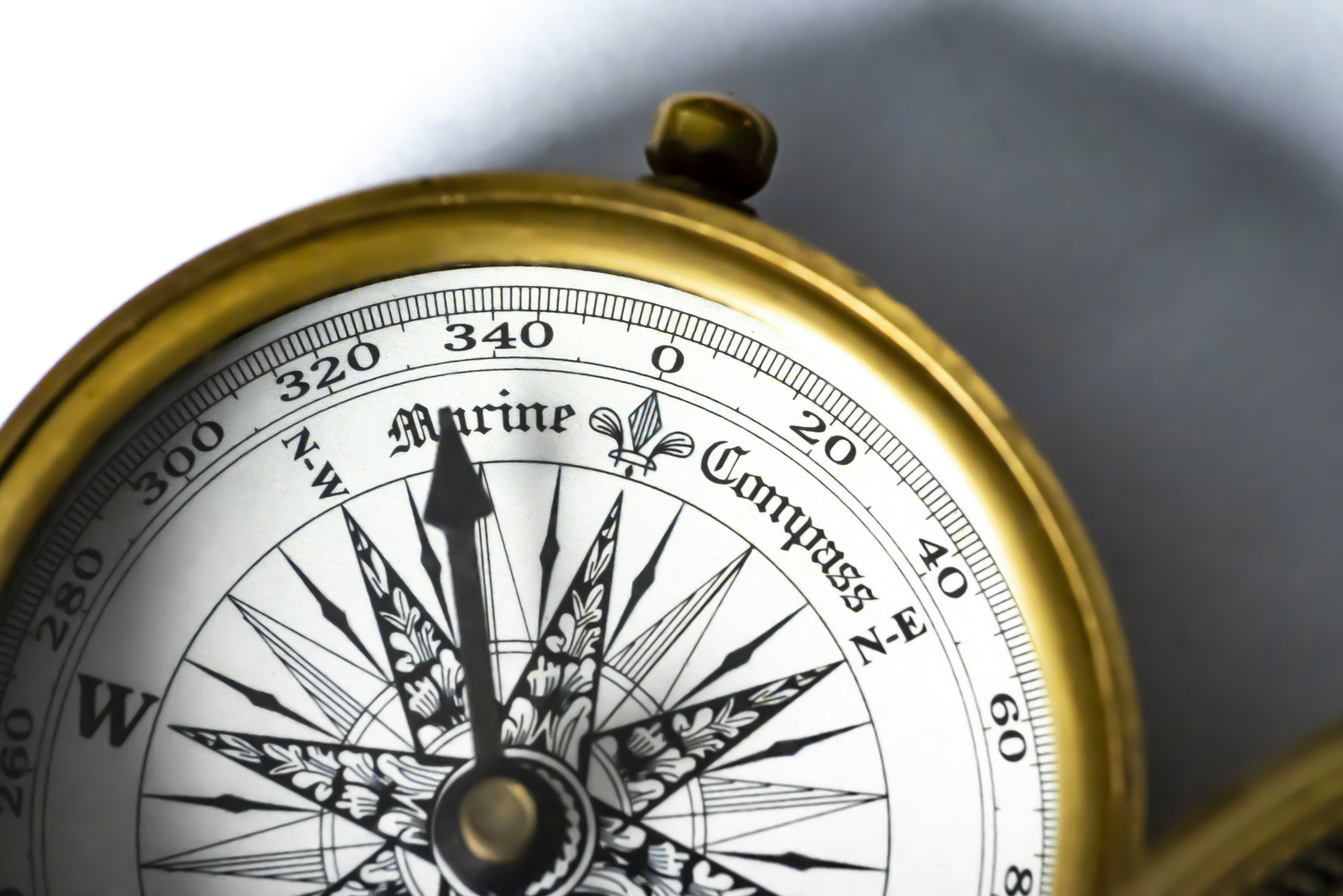 A close up of a compass on a white background photo – Free Compass ...