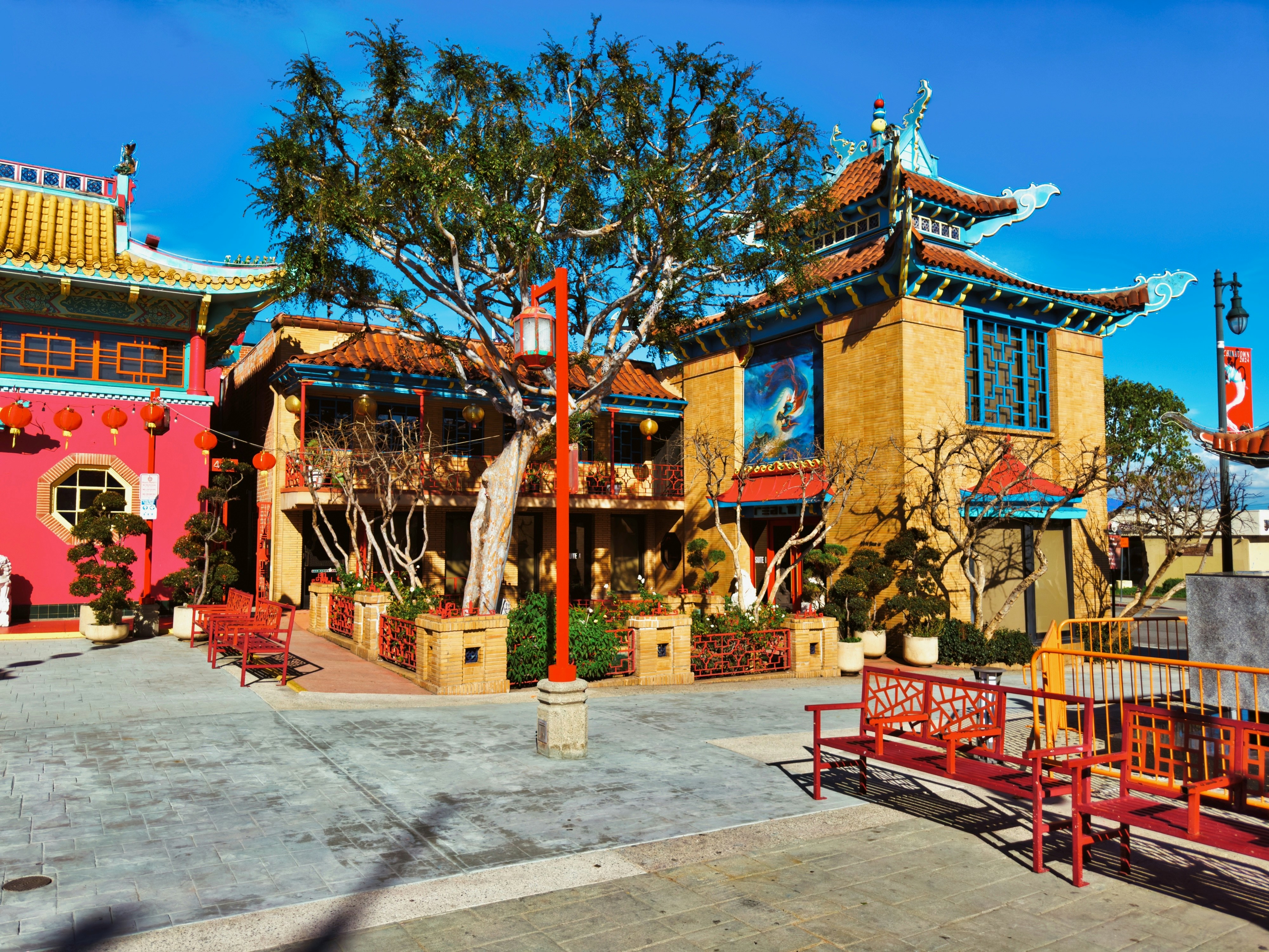 Crimson Benches and Painted Roofs: A Bright Temple Courtyard