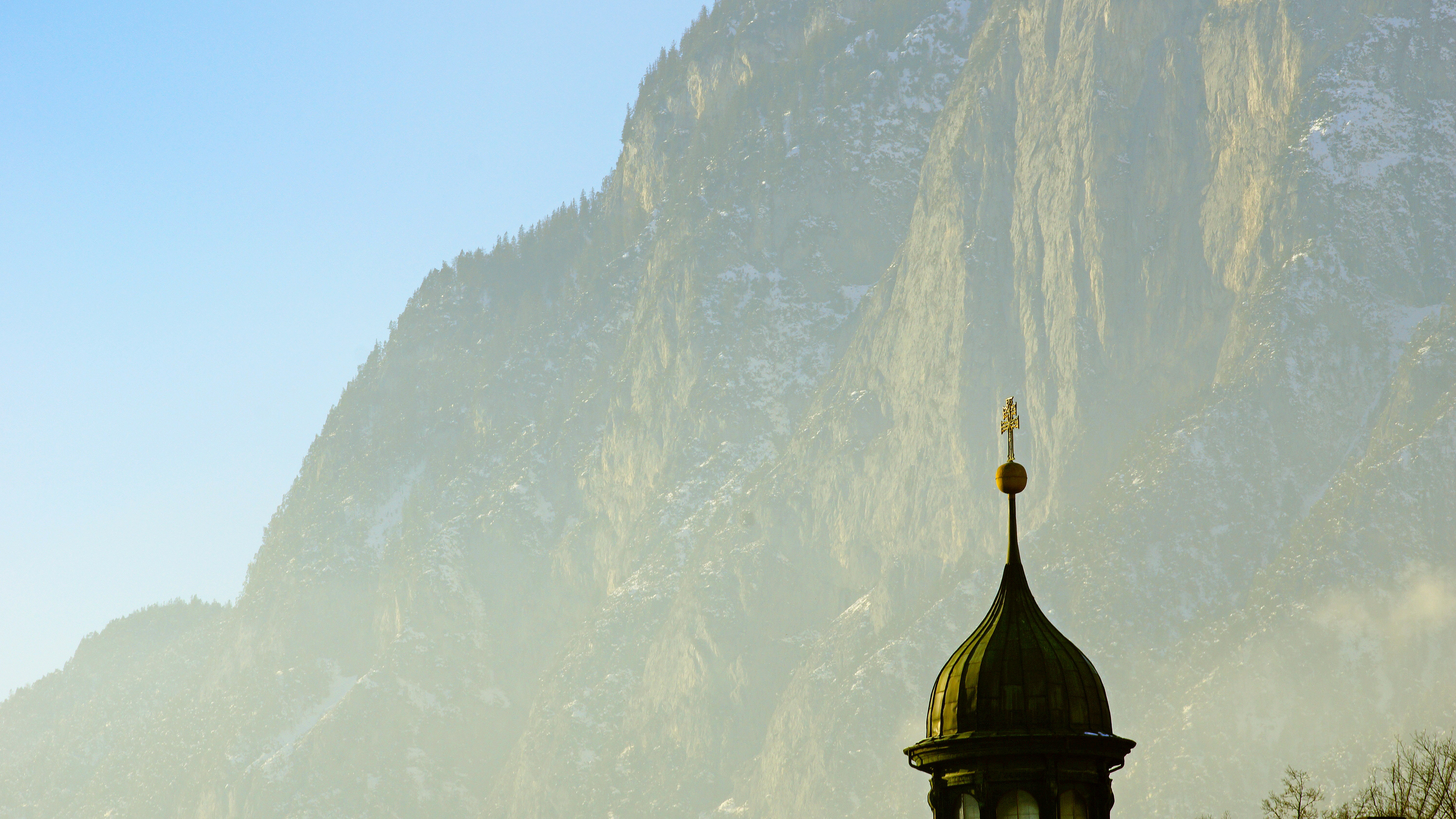 A church steeple with a mountain in the background photo – Free Peak ...