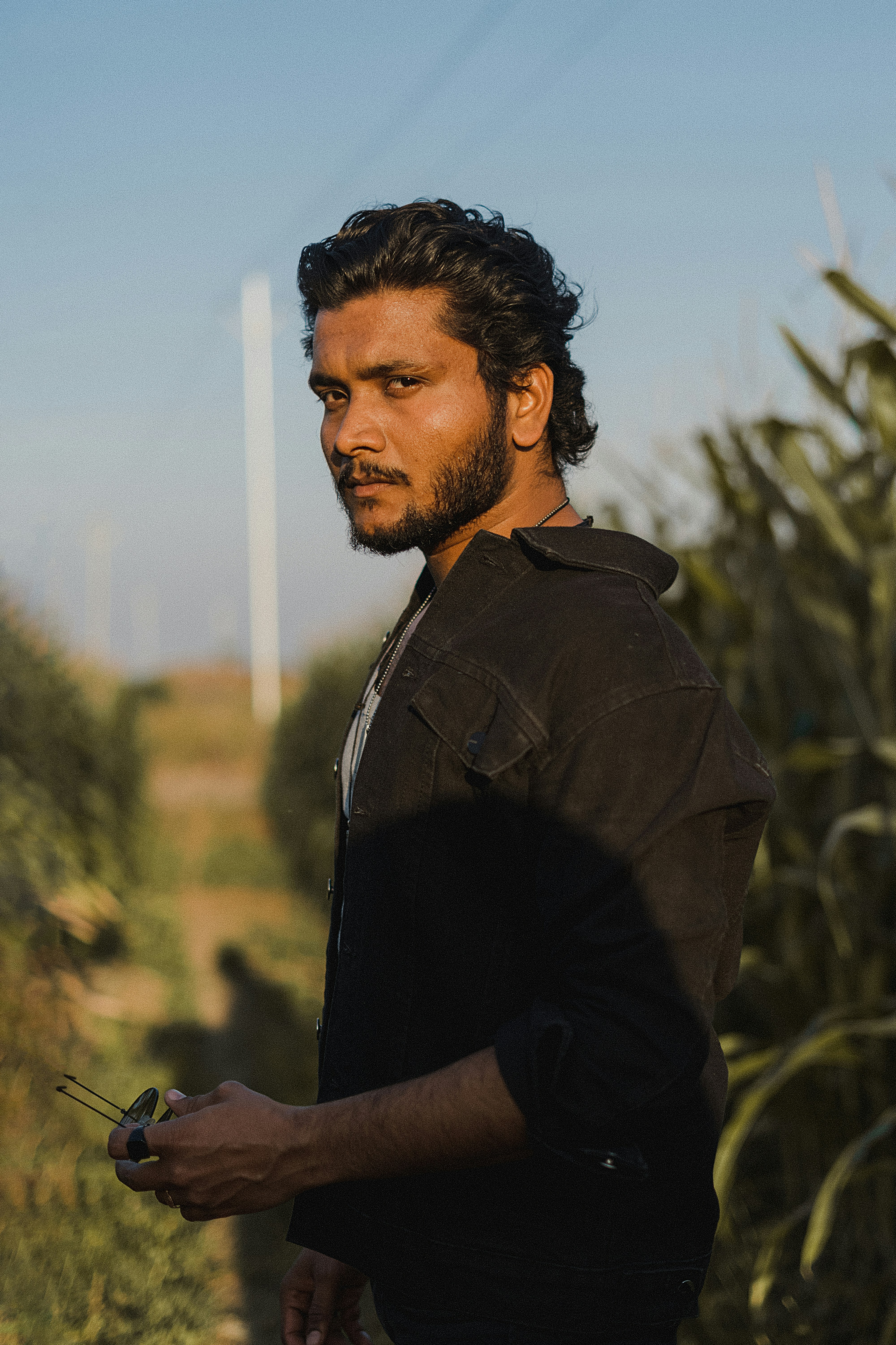 A man standing in front of a corn field photo – Free Portrait Image on ...