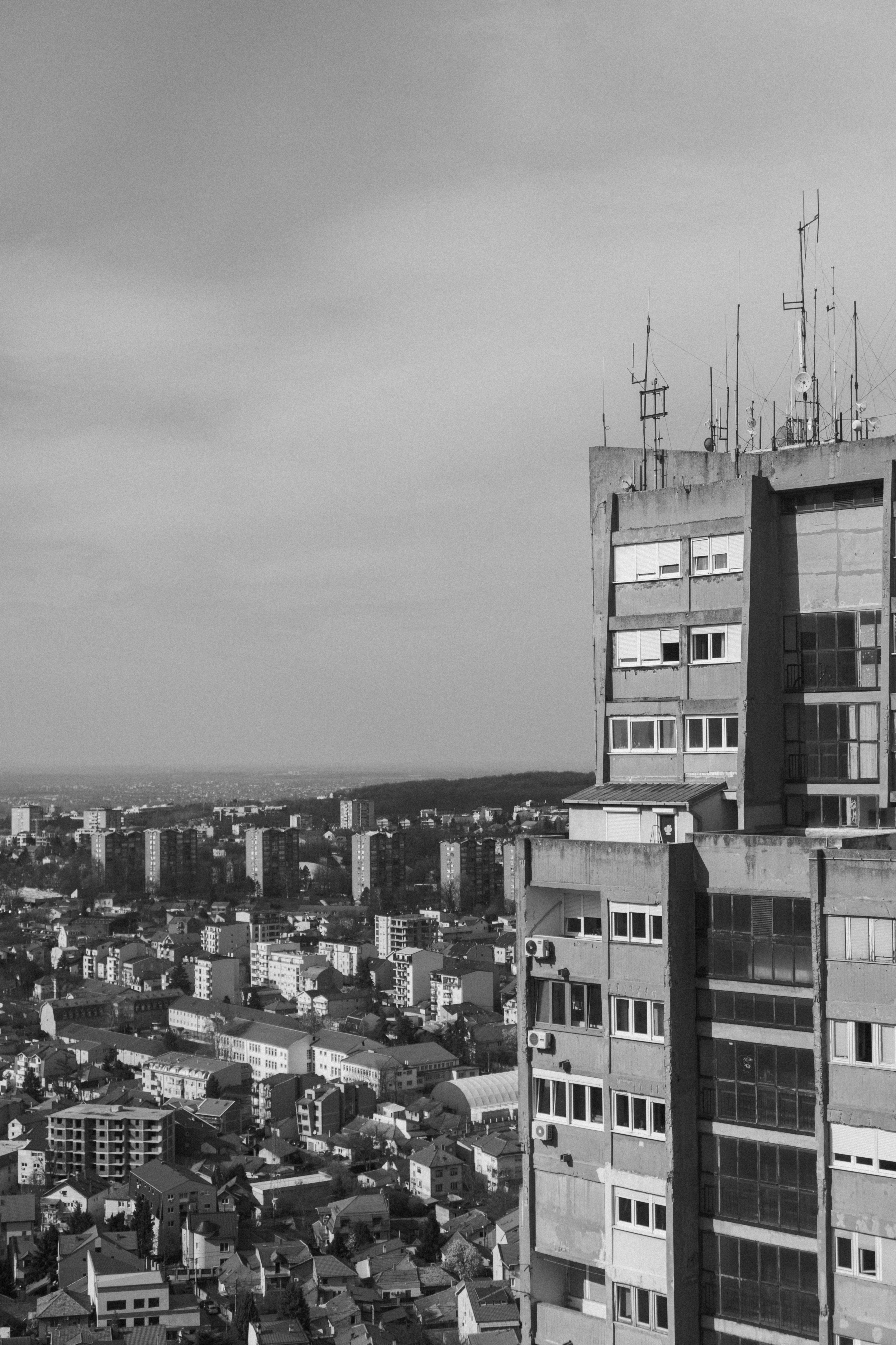 Antenna Crown Over a Concrete Skyline
