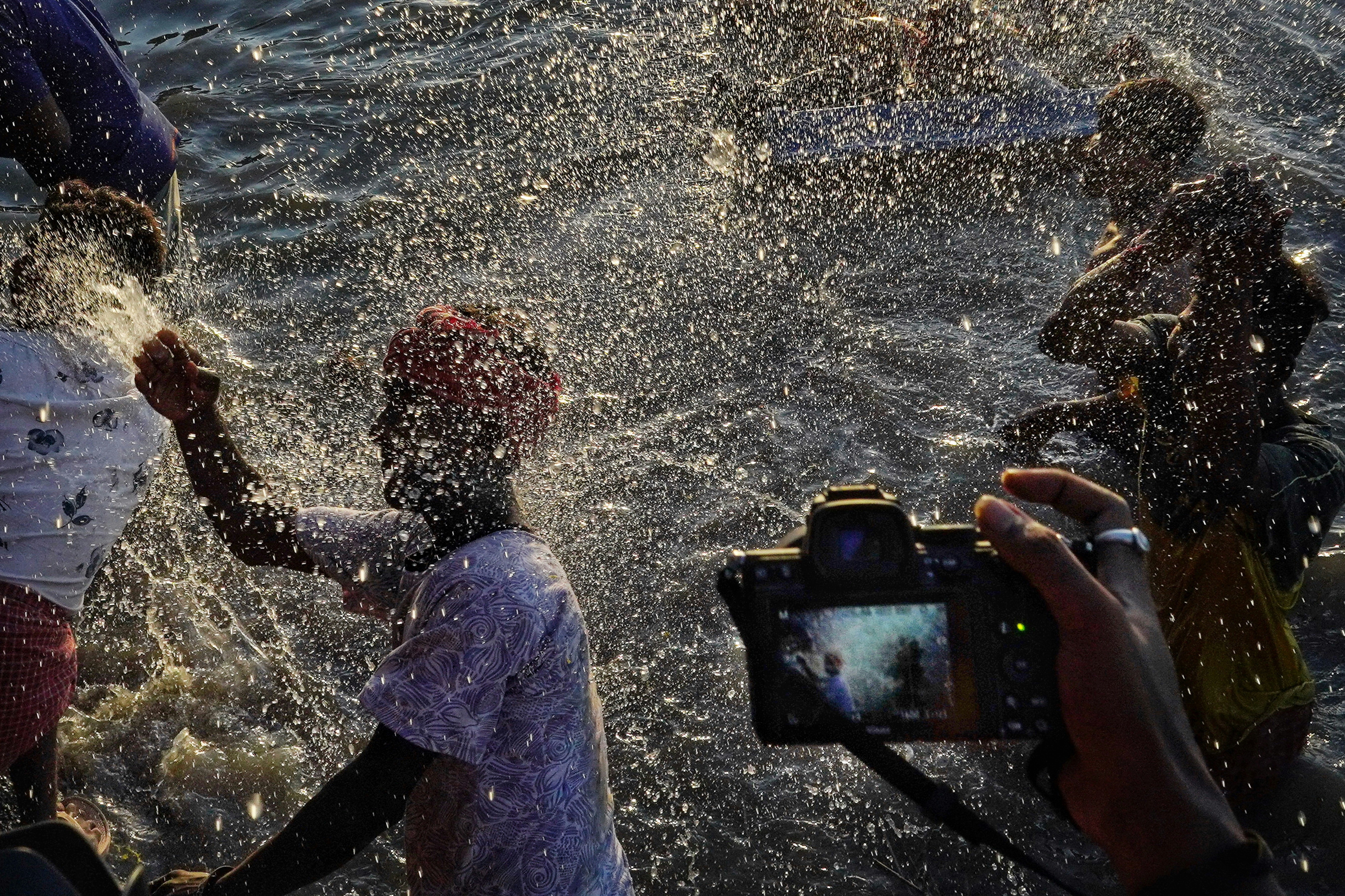 A group of people splashing in the water photo – Free Outdoors Image on ...