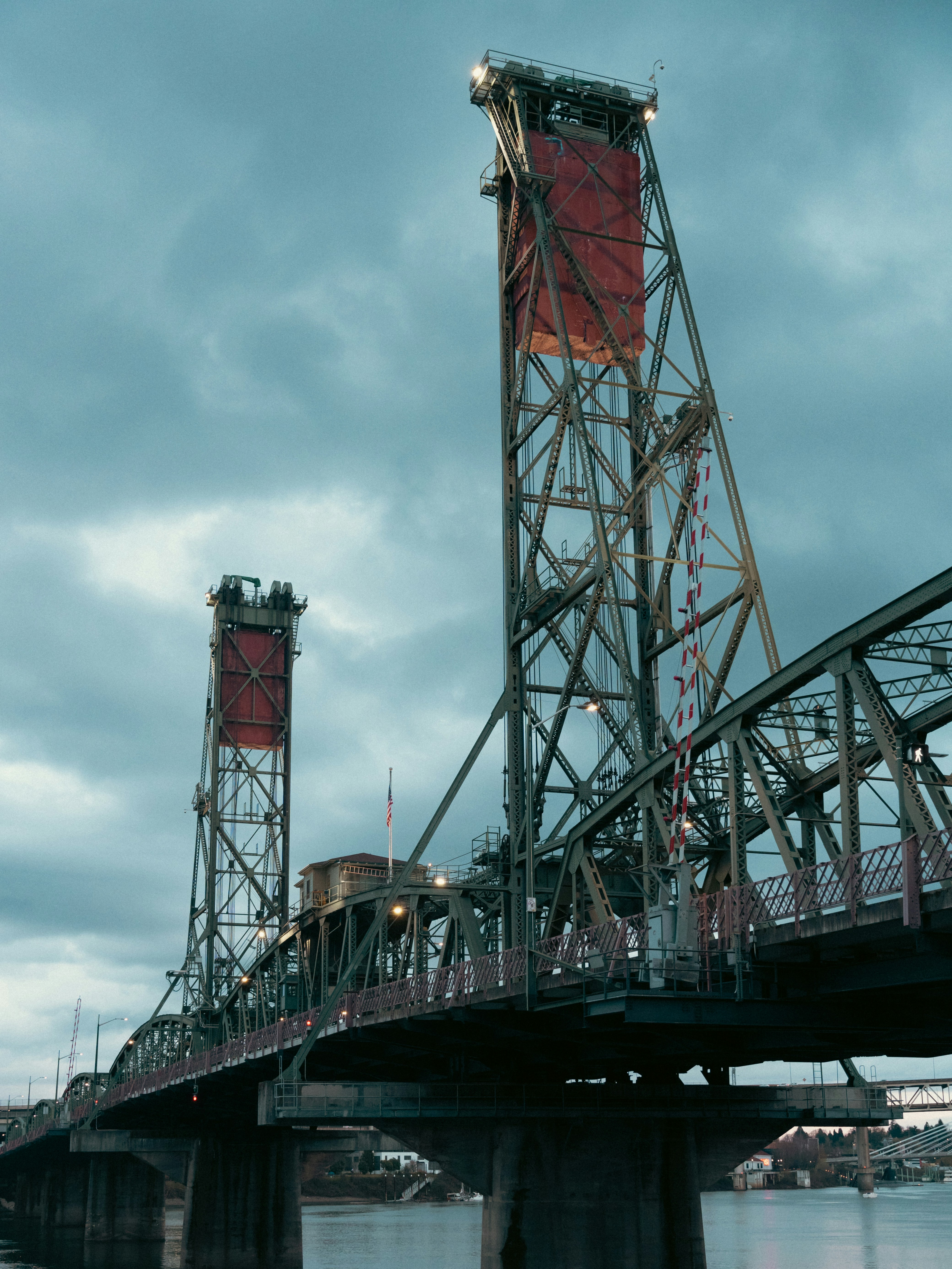 a bridge that has a red flag on itXimin Lin