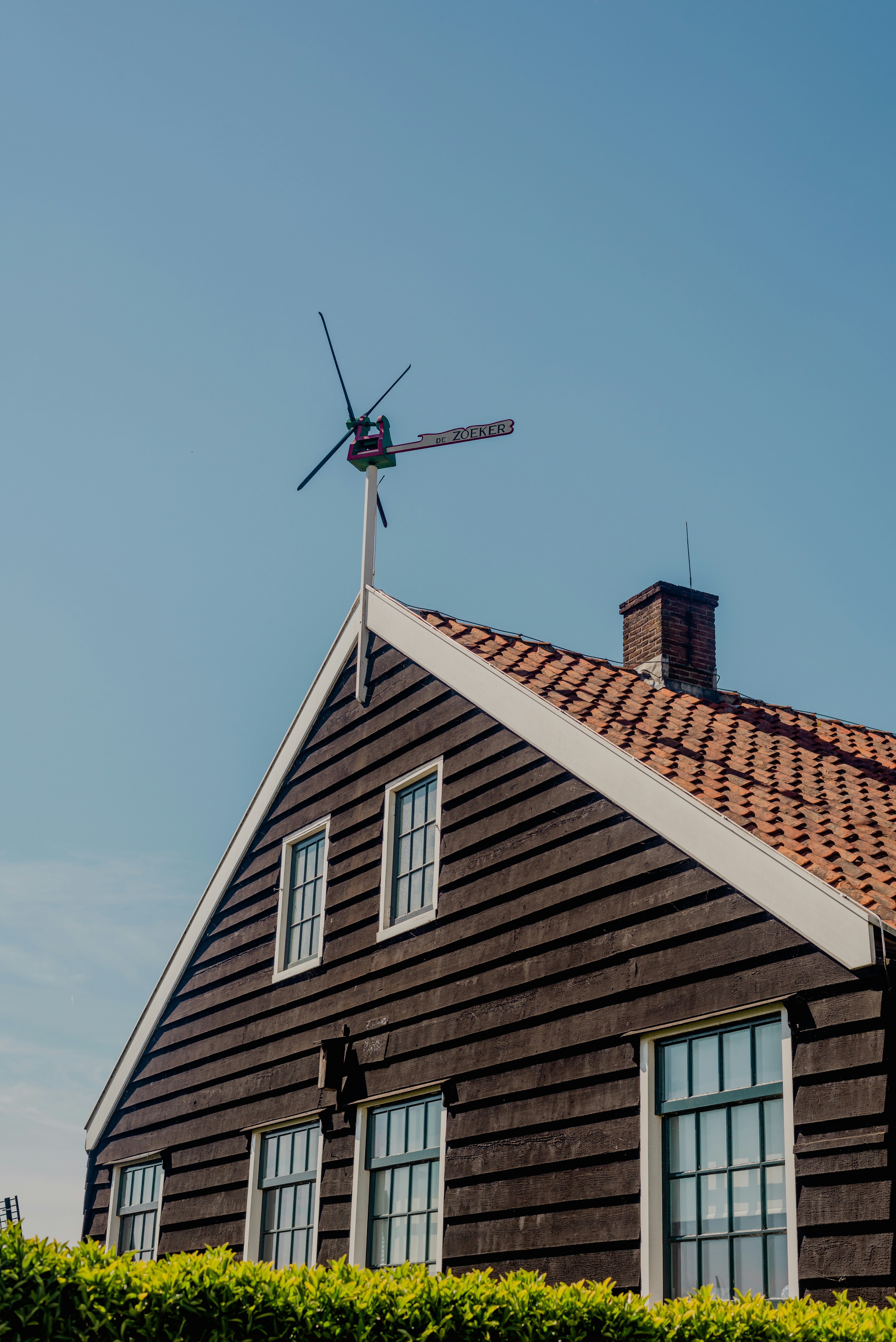Windward Gable: A Rustic Roof Ornament Reaches for the Sky