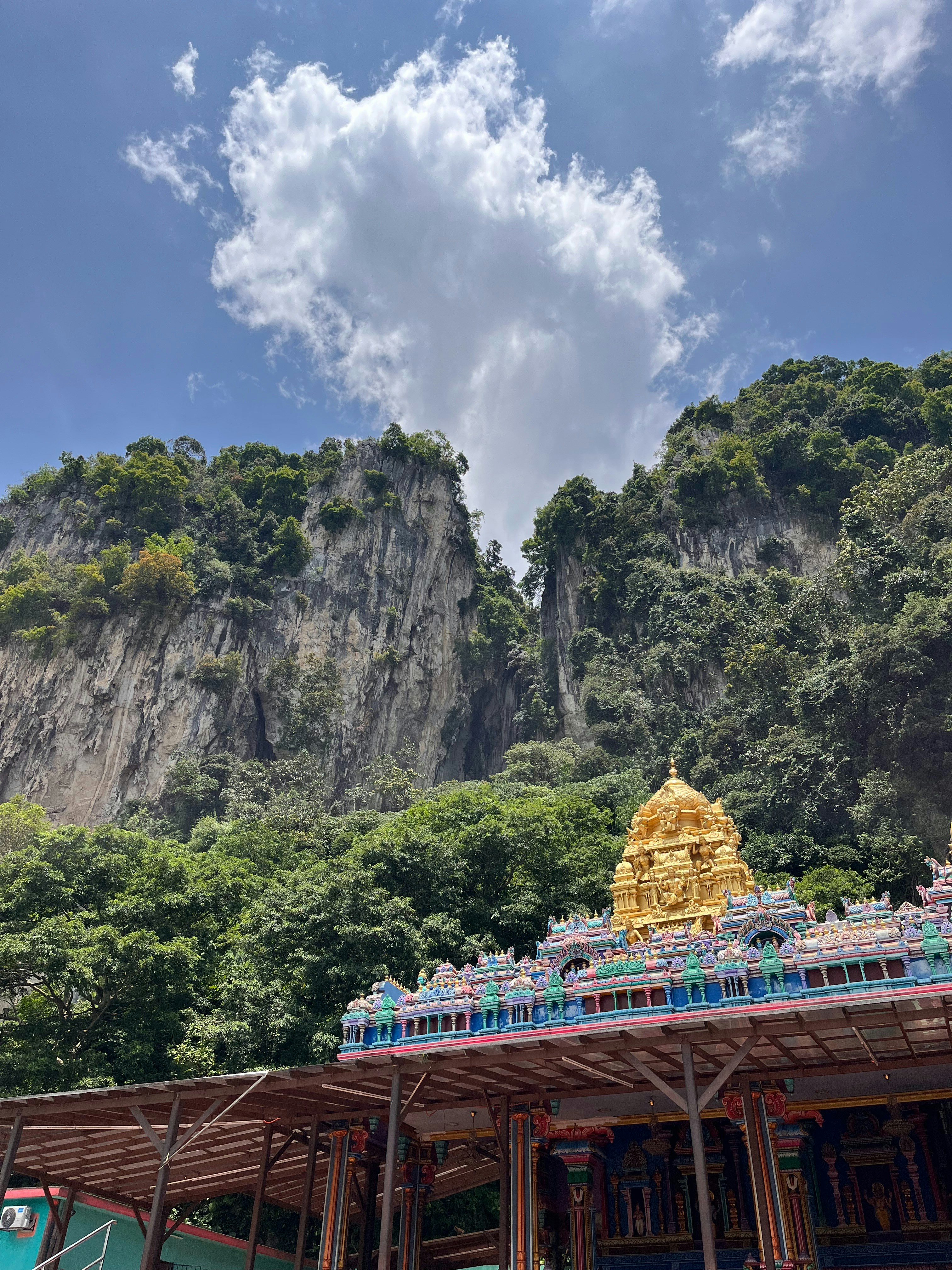 Golden Spire Framing a Lush Cliff: Temple Colors in Sunlight