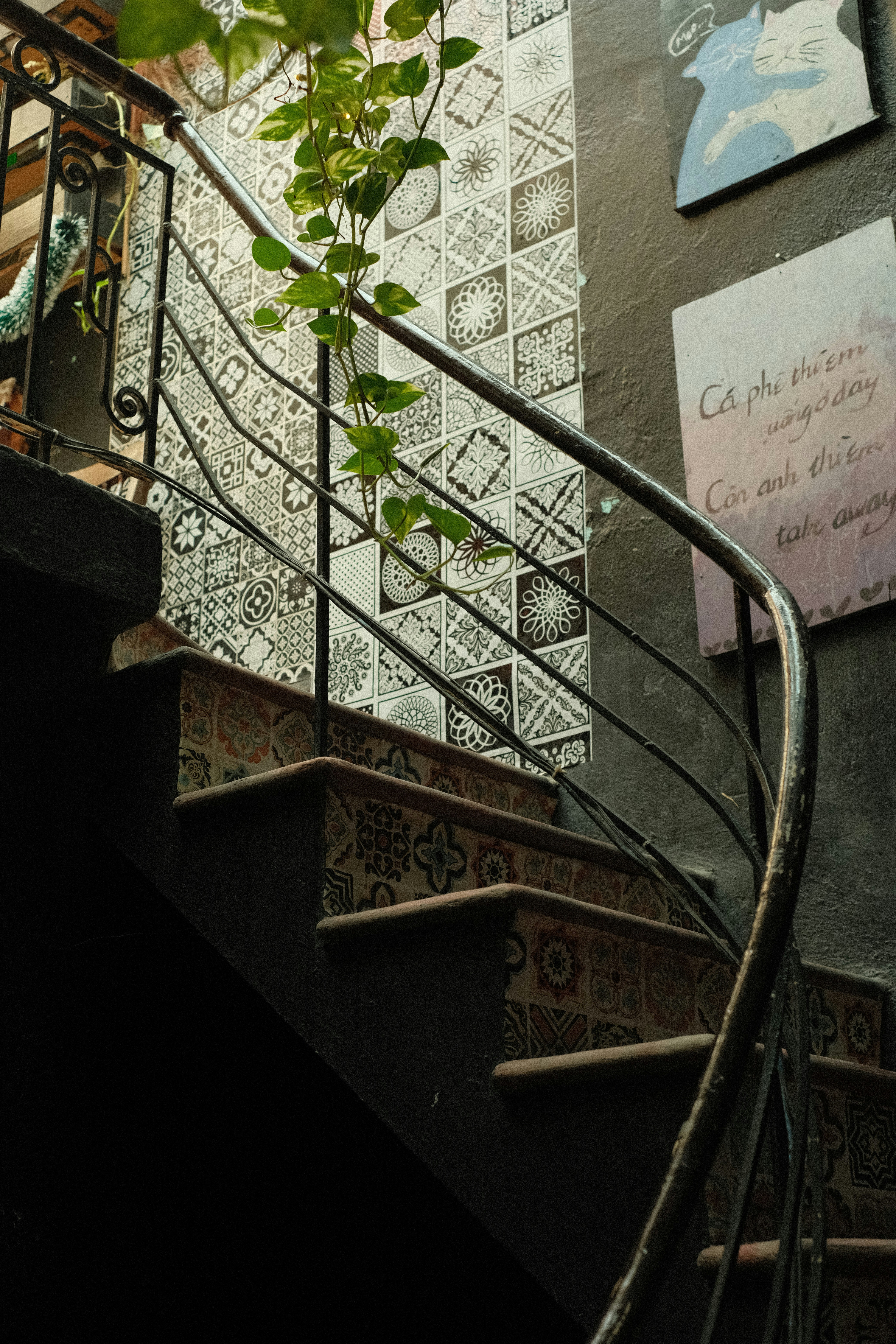 Vine Threads Through a Tile-Patterned Stairwell