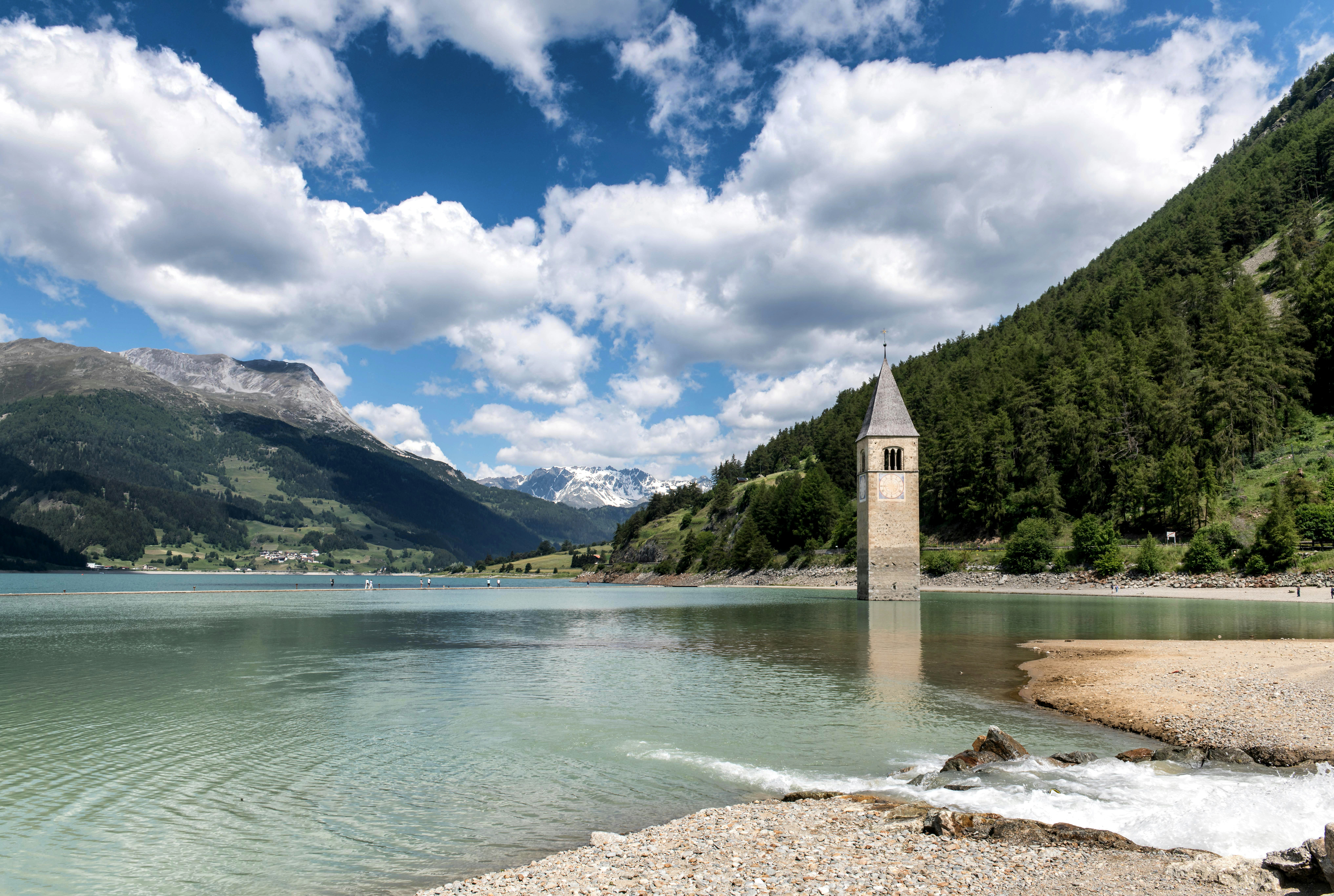 Tower in the Lake: A Bell-Tower Rising from Clear Alpine Waters