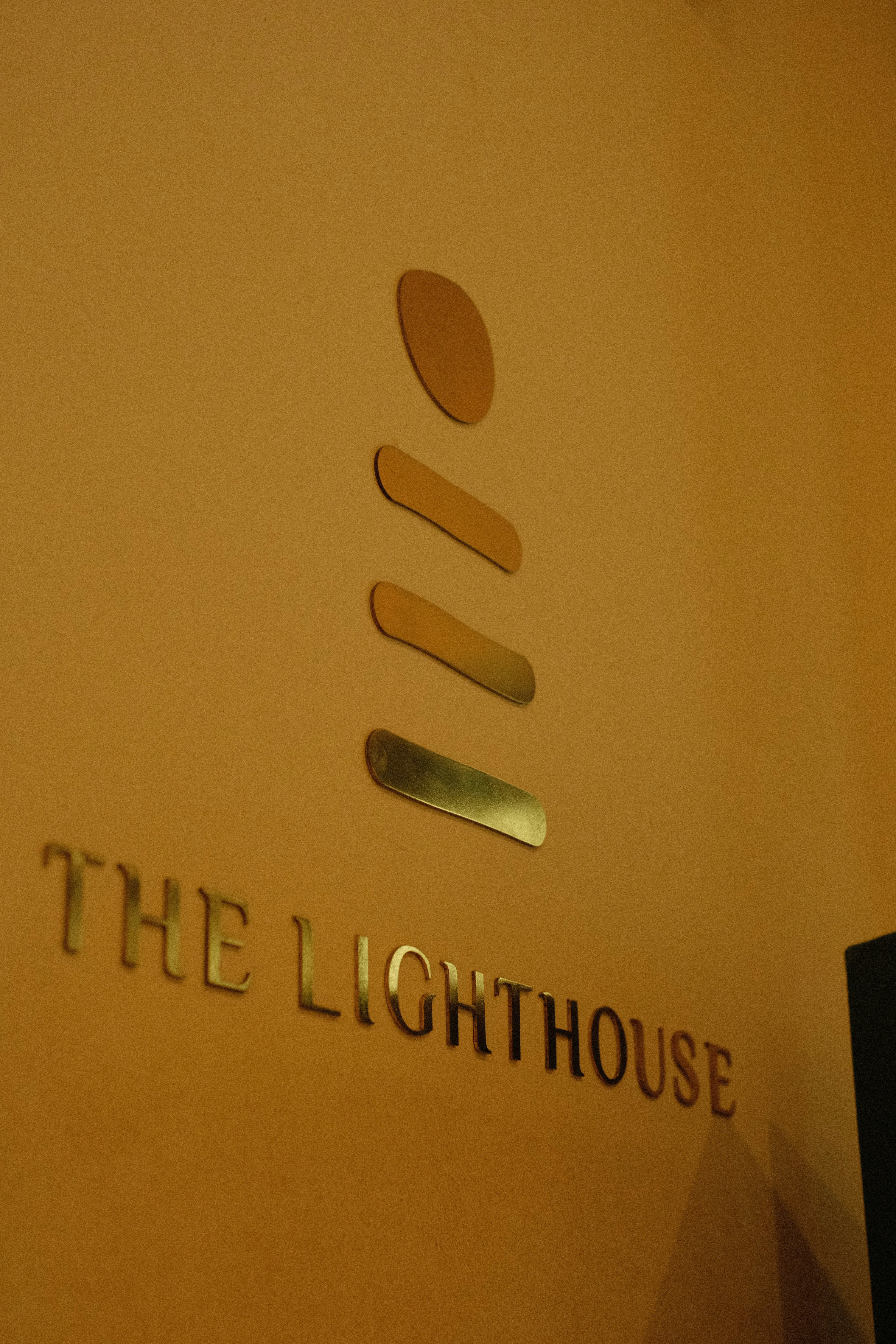 Lighthouse Signage at Night: The Luminous Wall of The Lighthouse