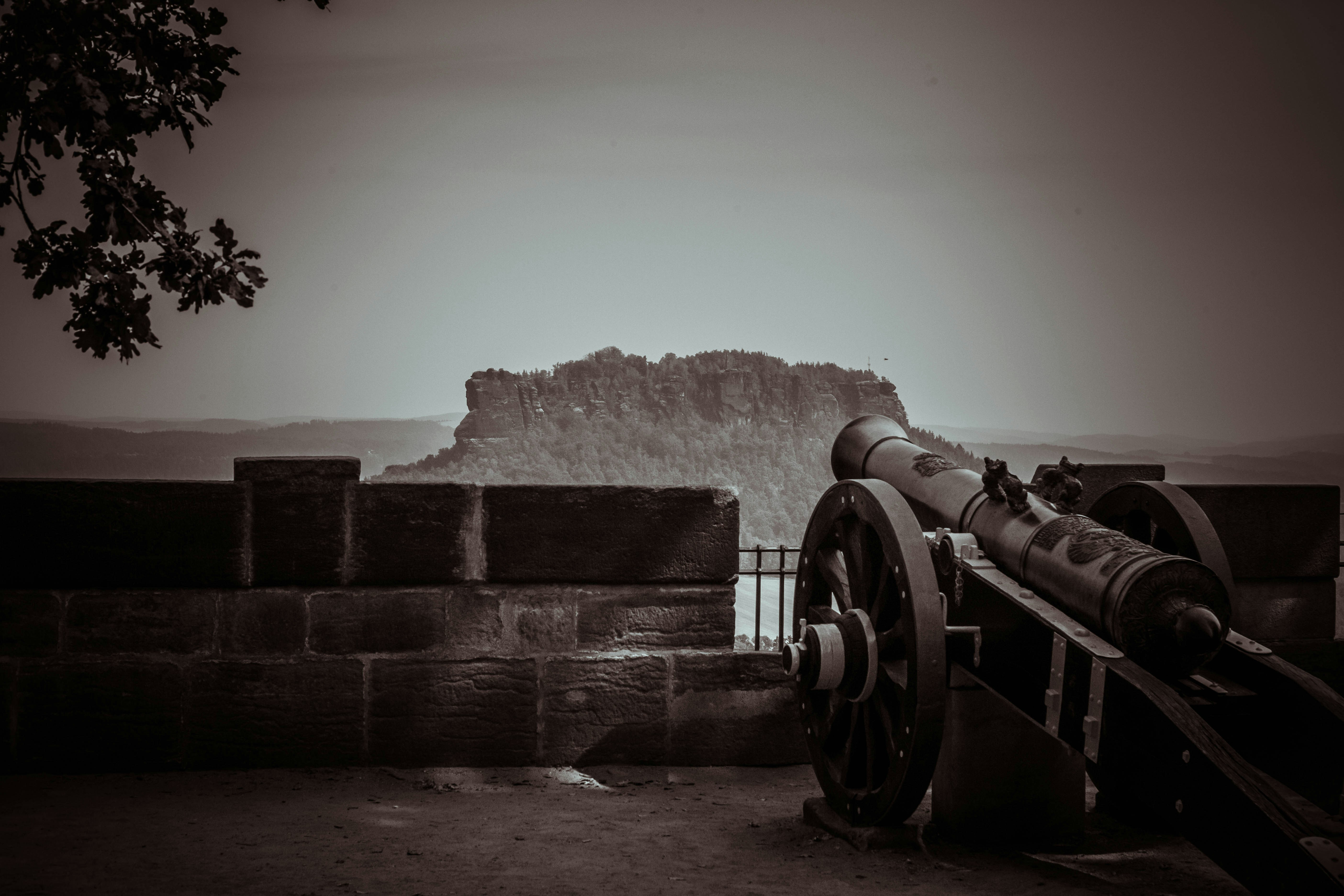 Sepia Sentinel: A Fort Cannon Points Toward a Distant Isle