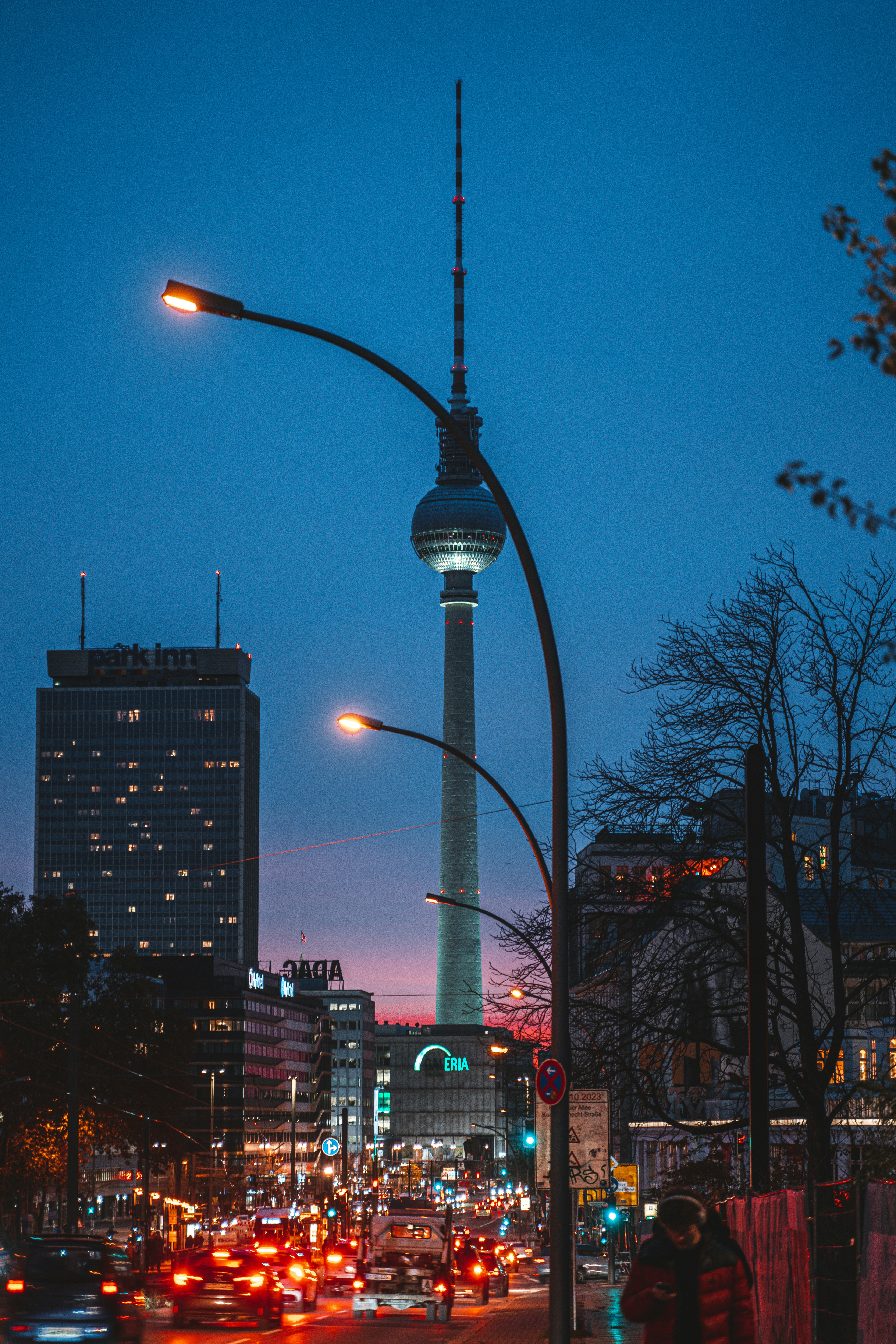 Dusk over Berlin: Fernsehturm Rising Above Neon Street Currents