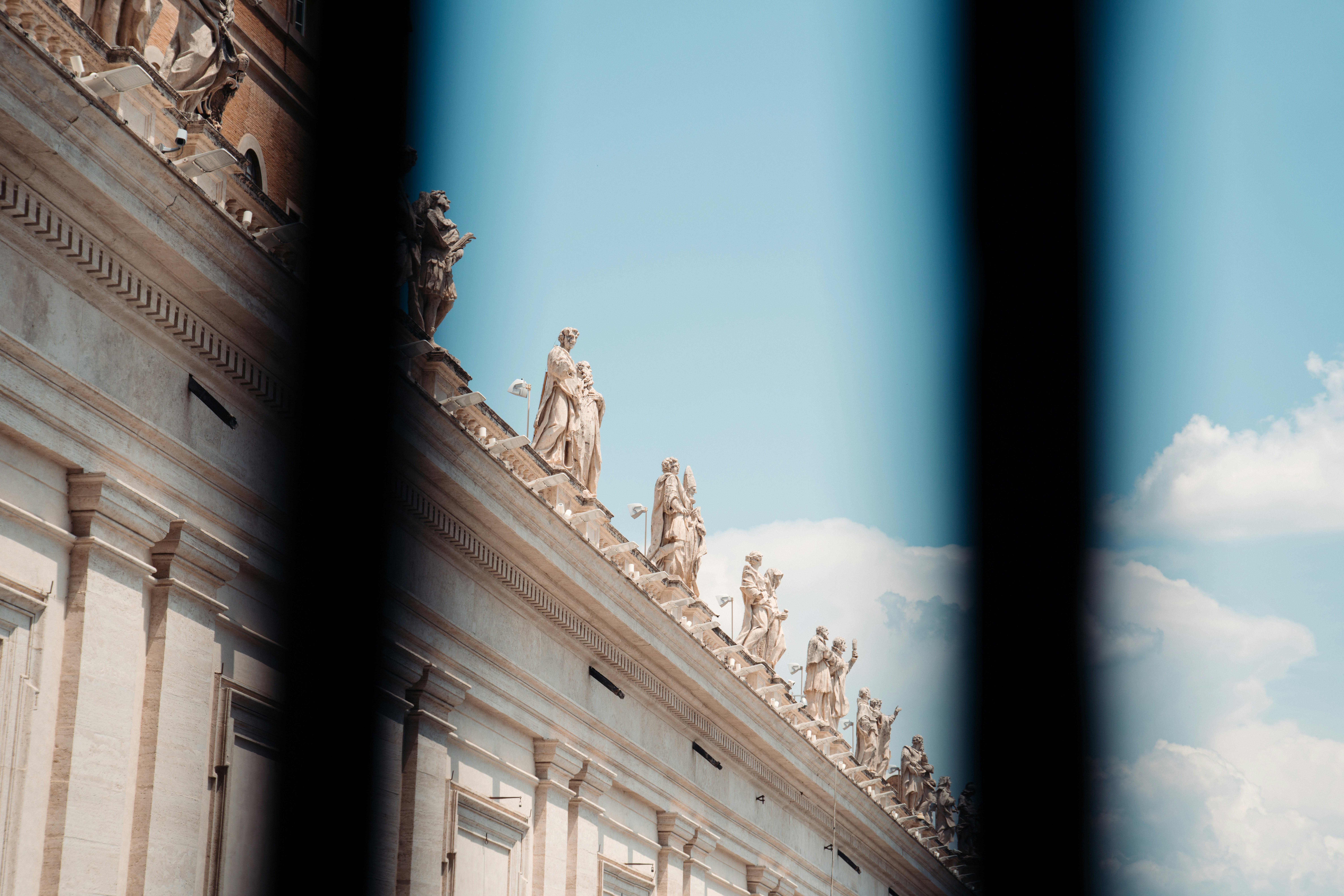 A building with statues on top of it photo – Free Vatican city Image on ...