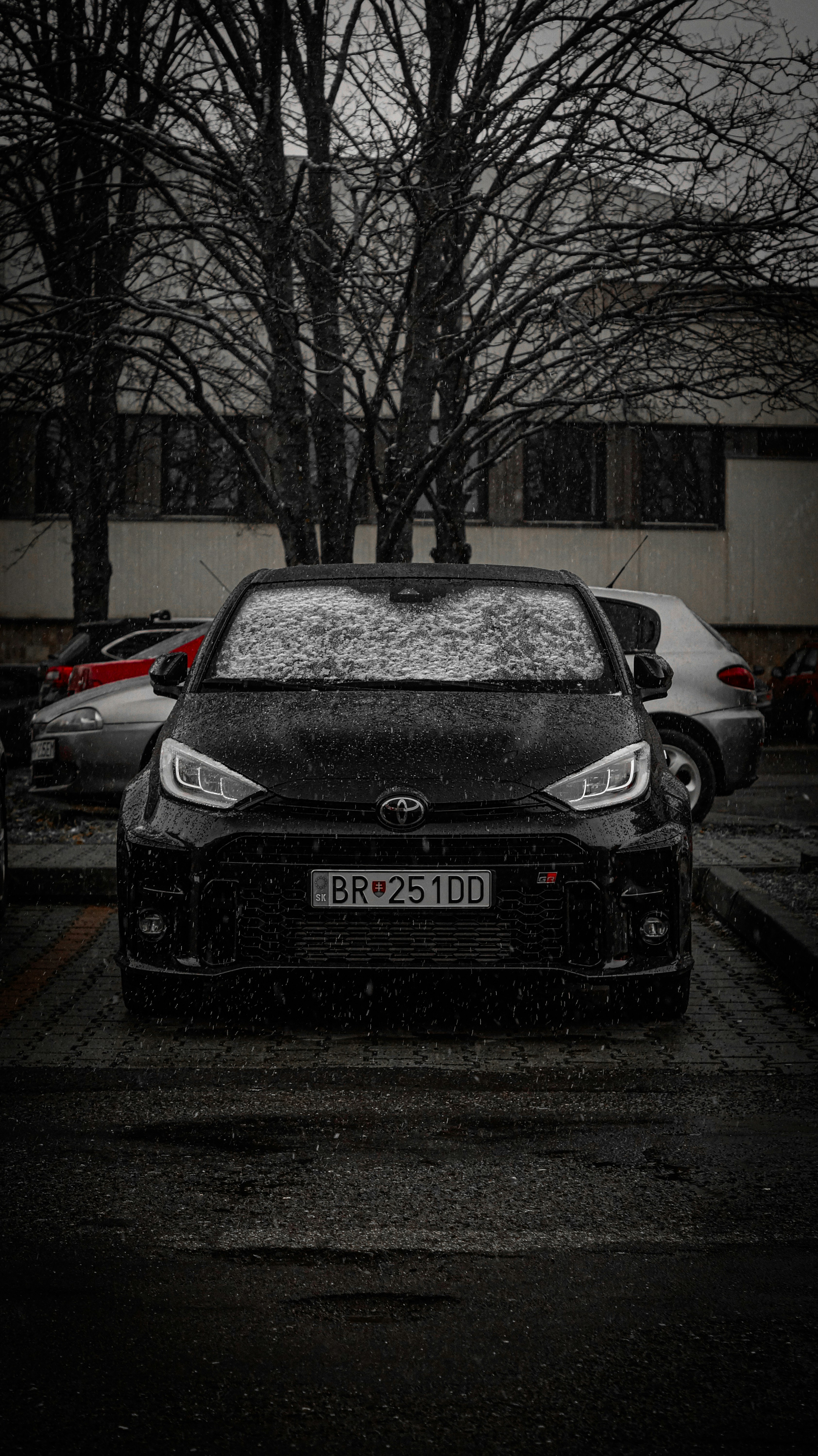 A car is parked in a parking lot in the snow photo – Free Poprad Image ...