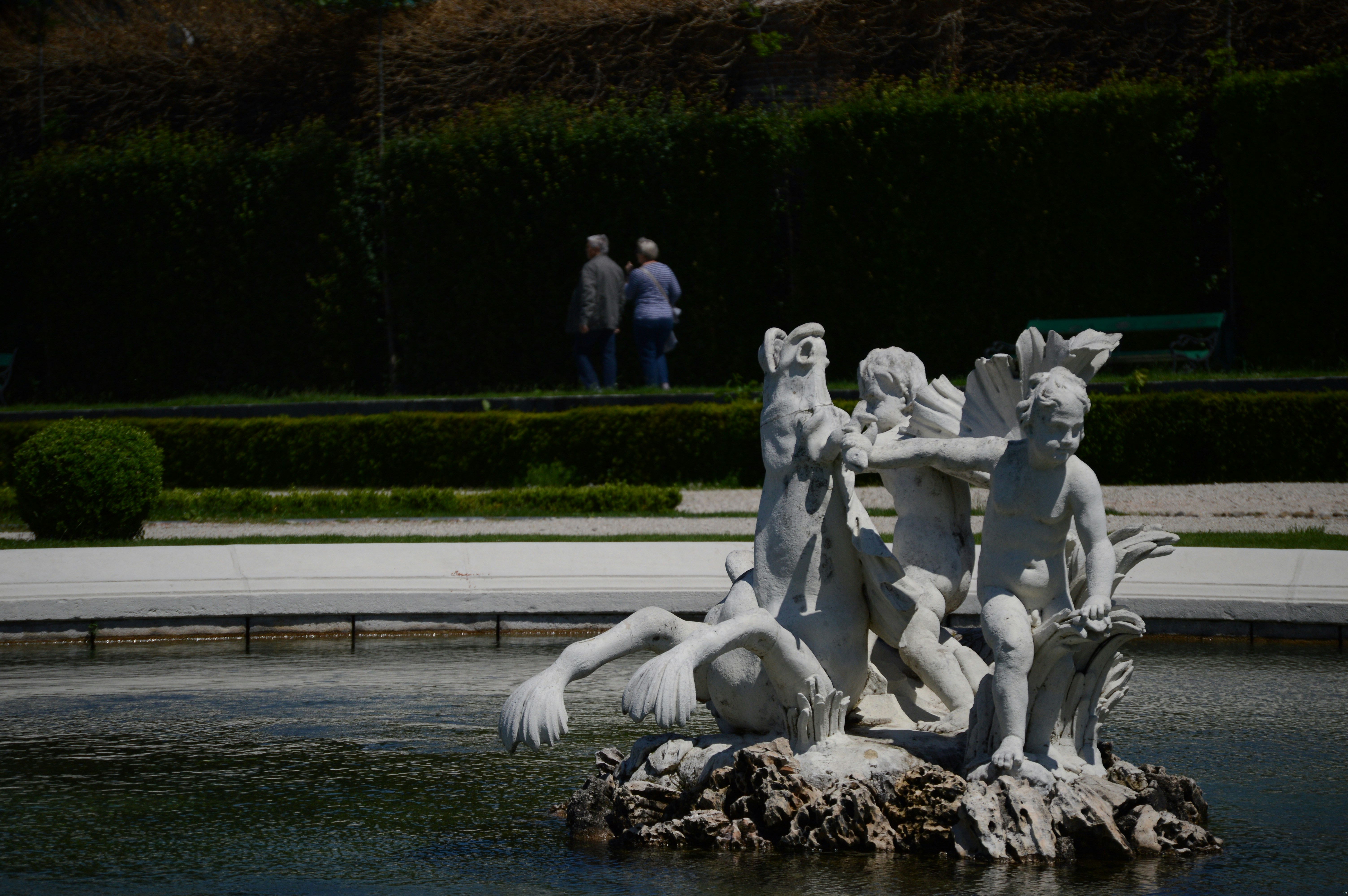 Statues at the Water’s Edge: Sculpted Figures Rising from the Fountain