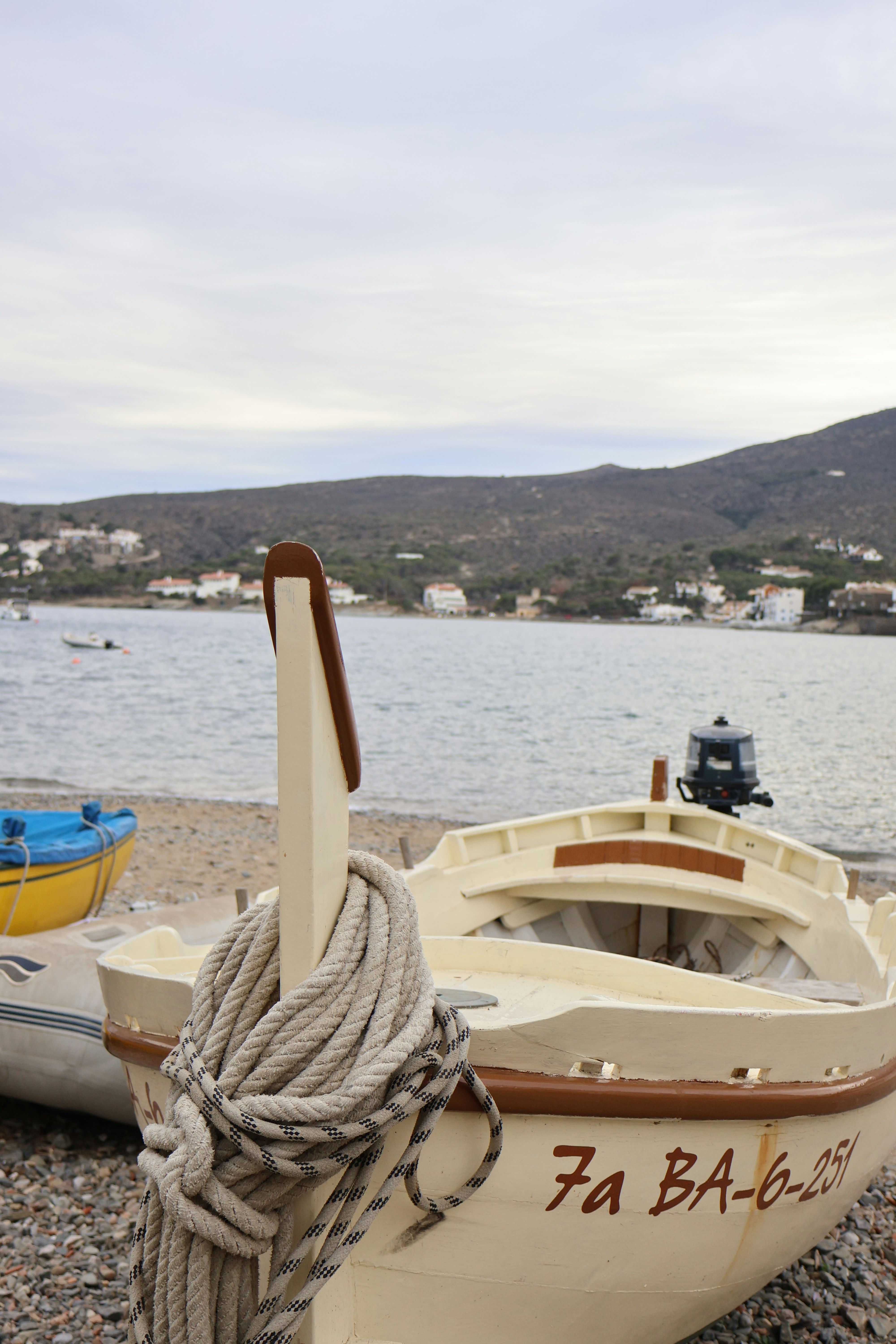 Rope-Wrapped Bow on a Pebble Harbor