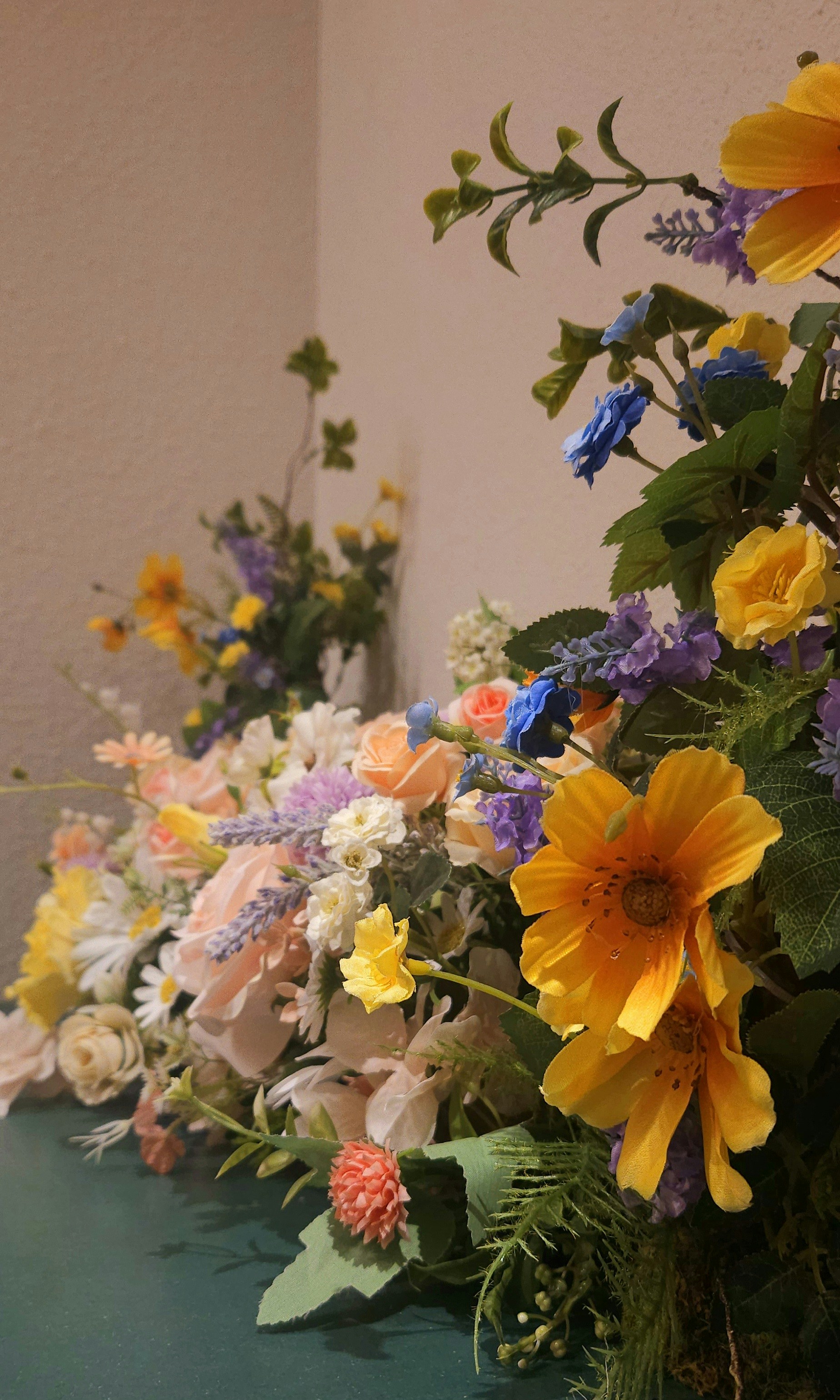 Ember-Toned Bouquet on a Teal Table