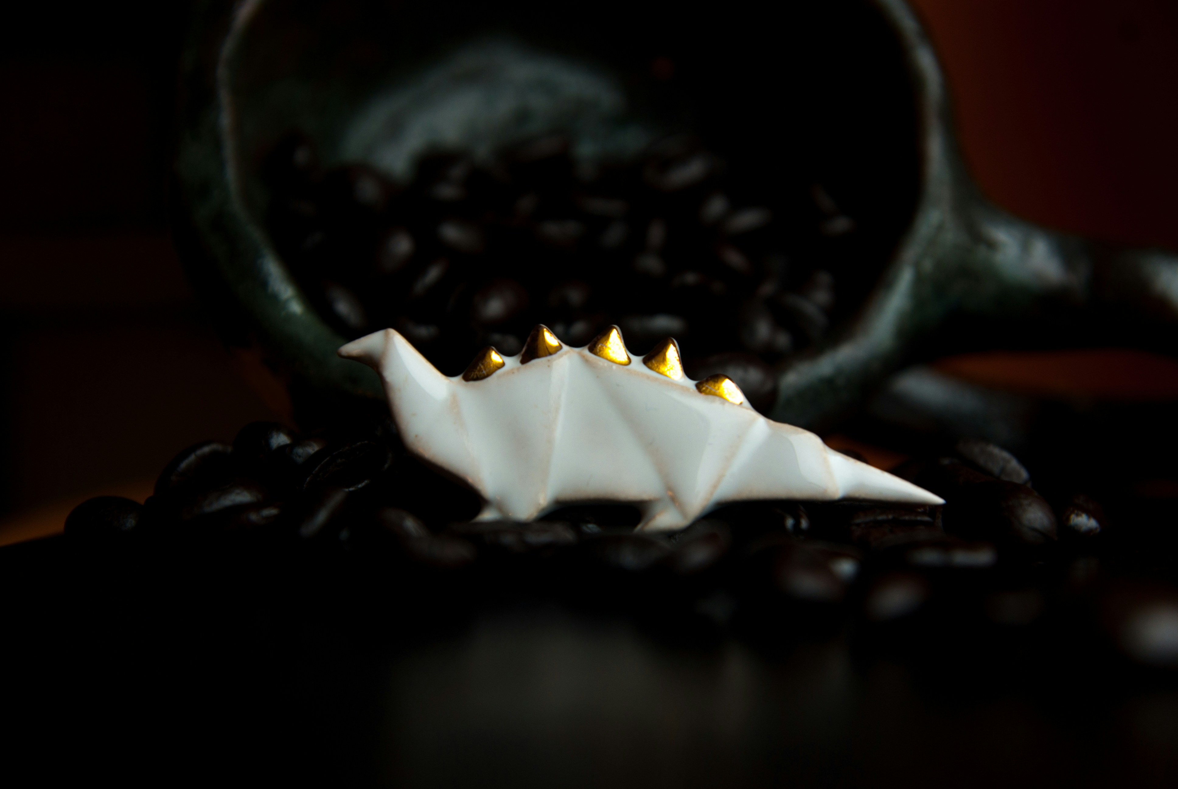 Gold-Tipped Crown on a Bed of Coffee Beans