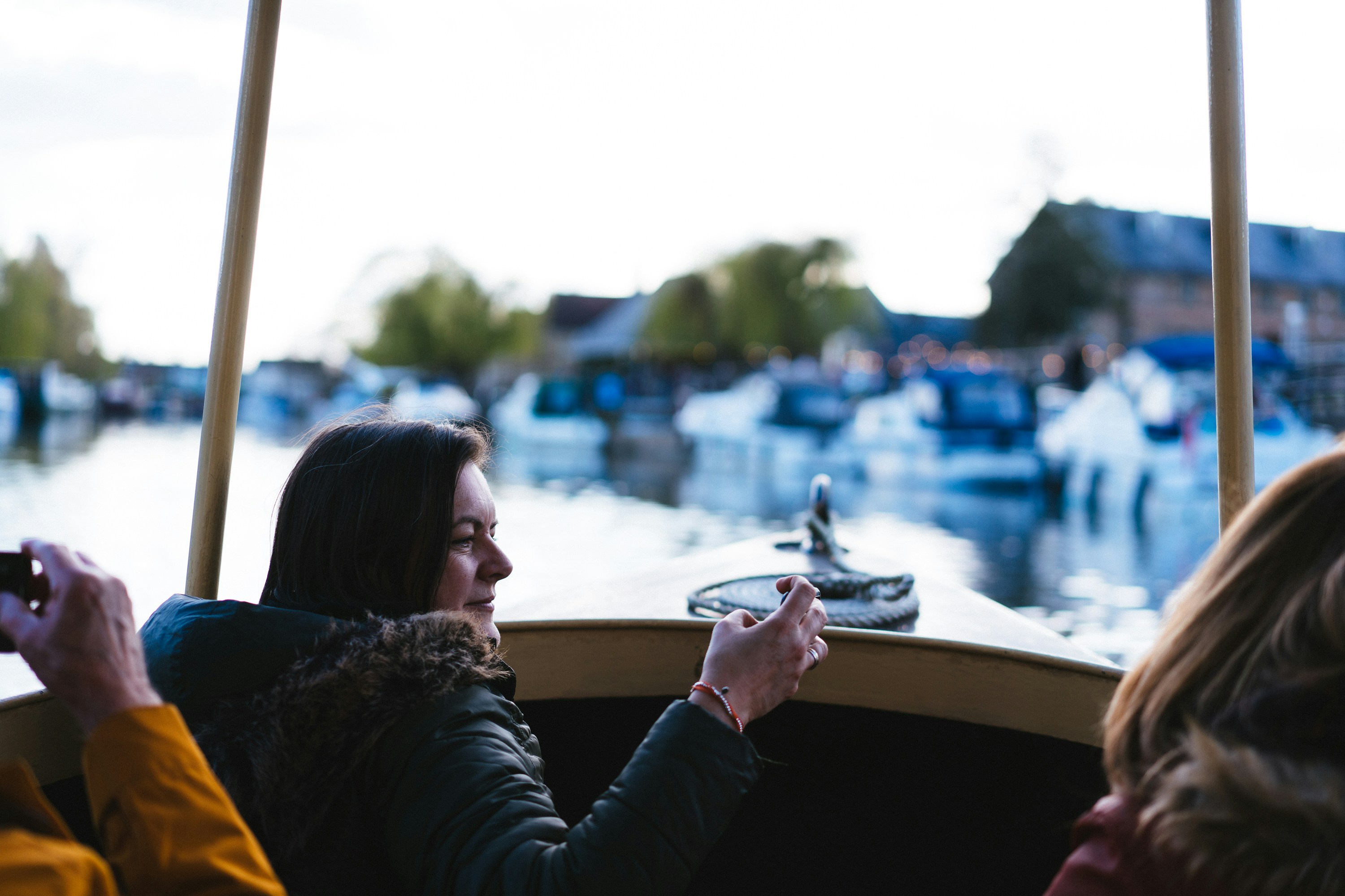 Faces at the Bow: A Quiet Moment Aboard the Marina Boat