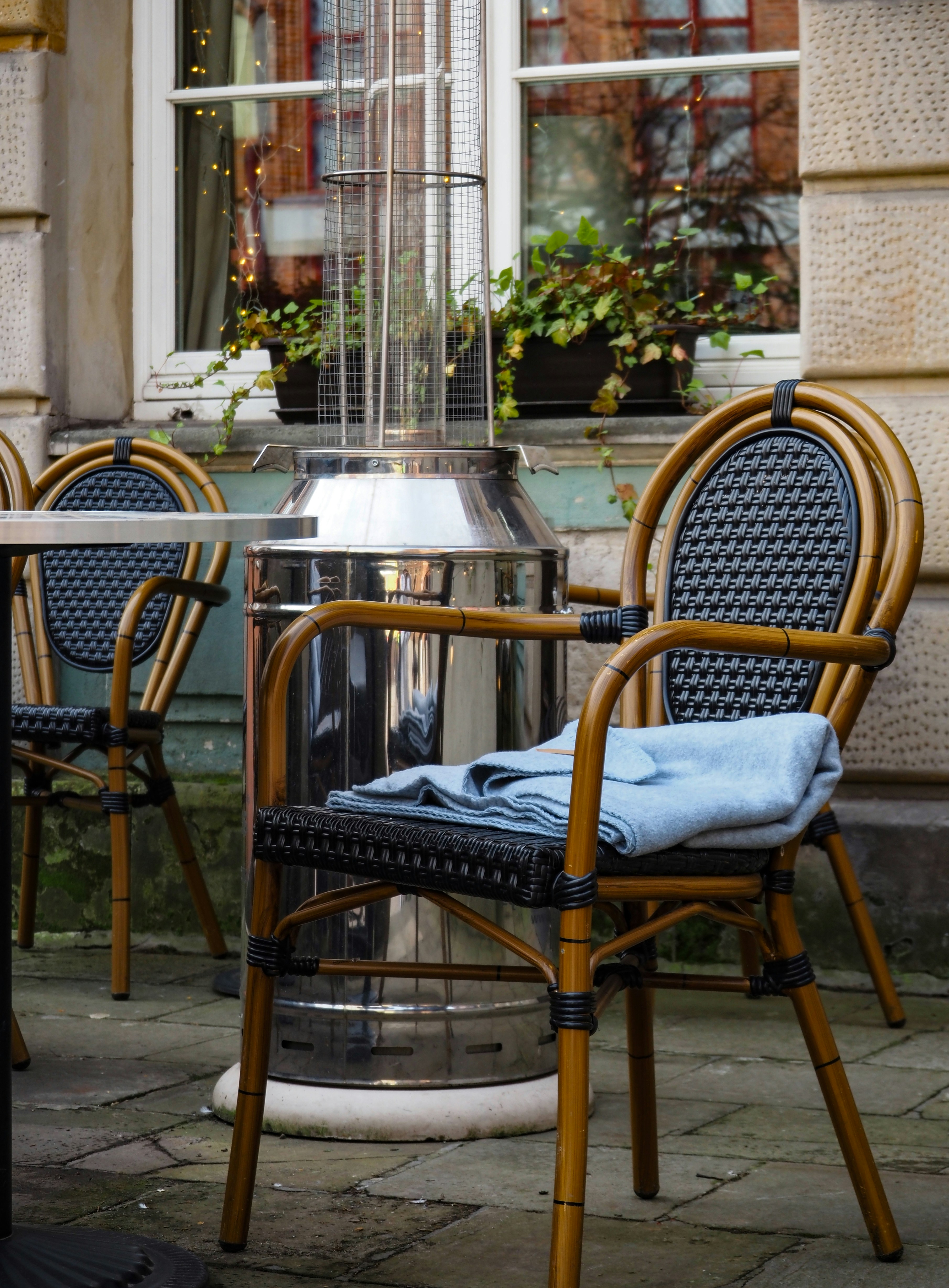 Café Terrace with Woven Chairs and a Stellar Heater