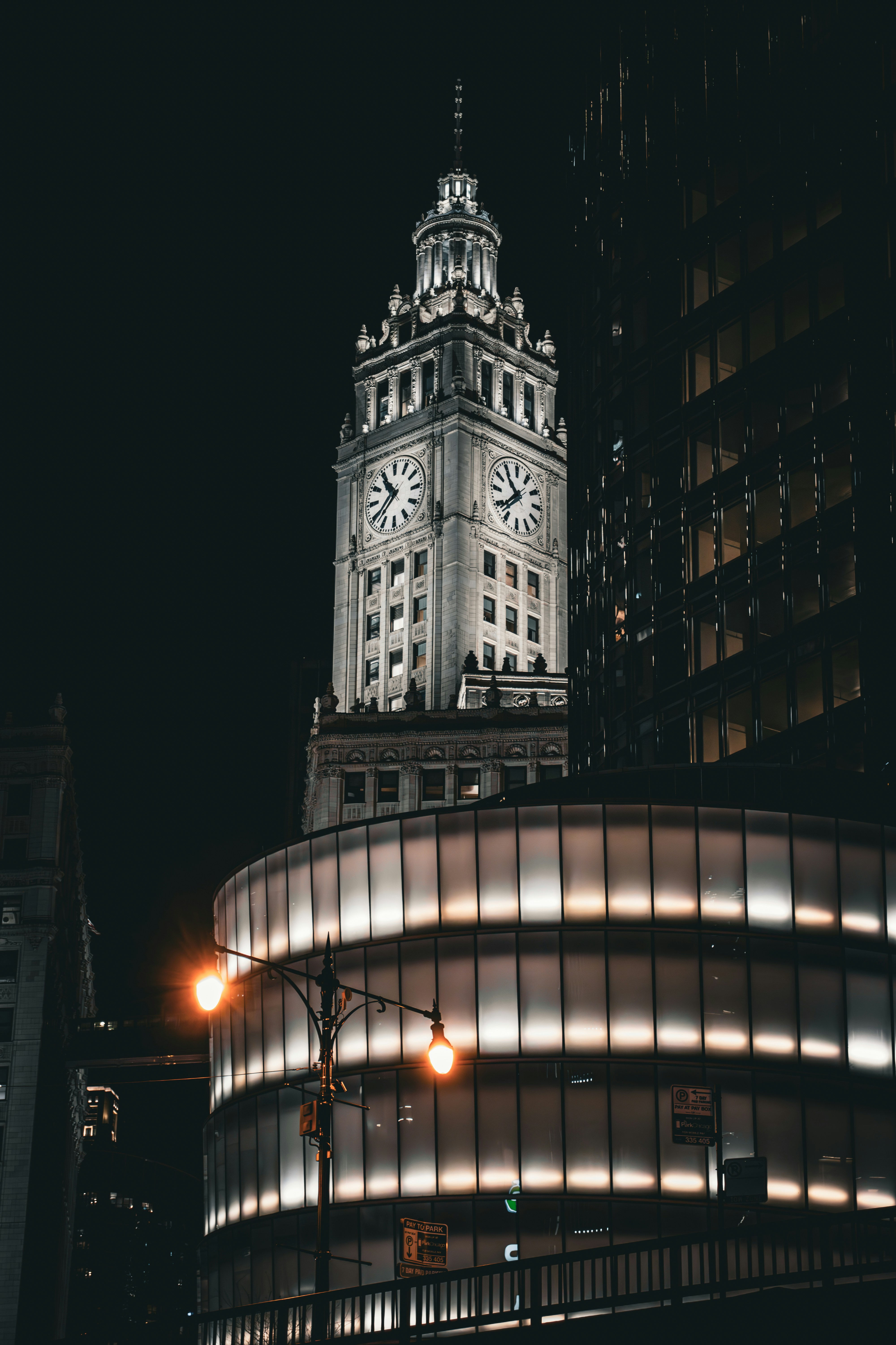 Nocturnal Clocktower Over a Glowing Circular Plaza