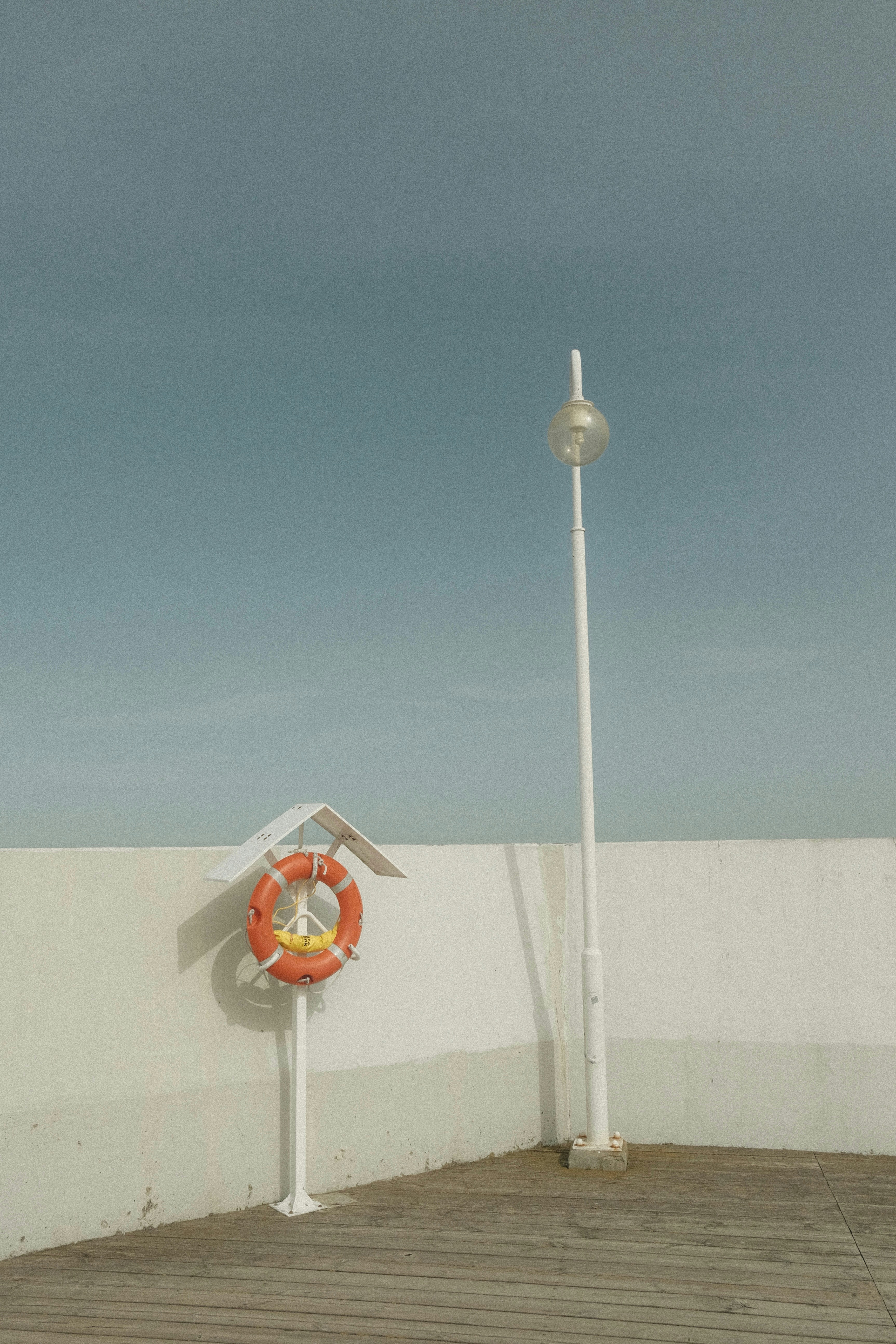 A life preserver on the side of a building photo – Free Poland Image on ...