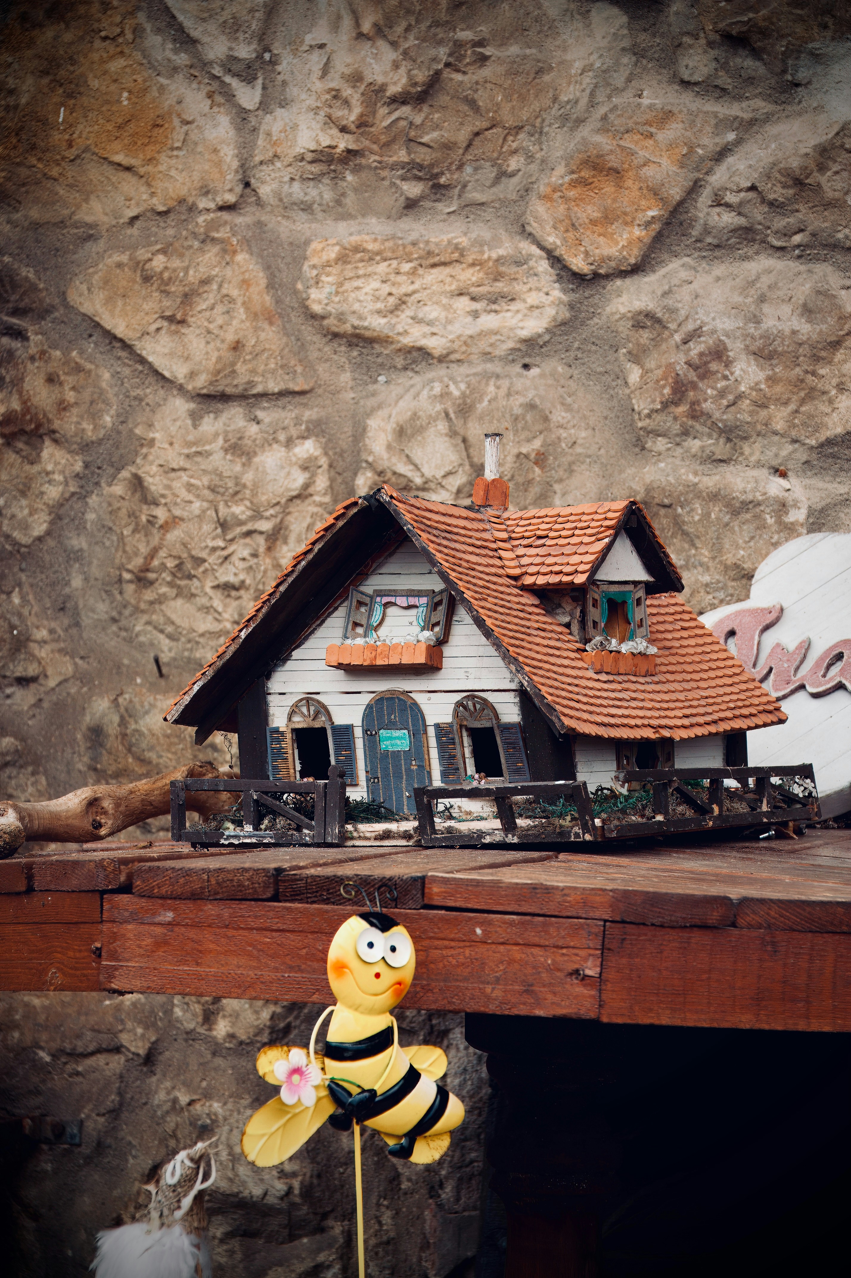 a toy bee sitting on top of a wooden table