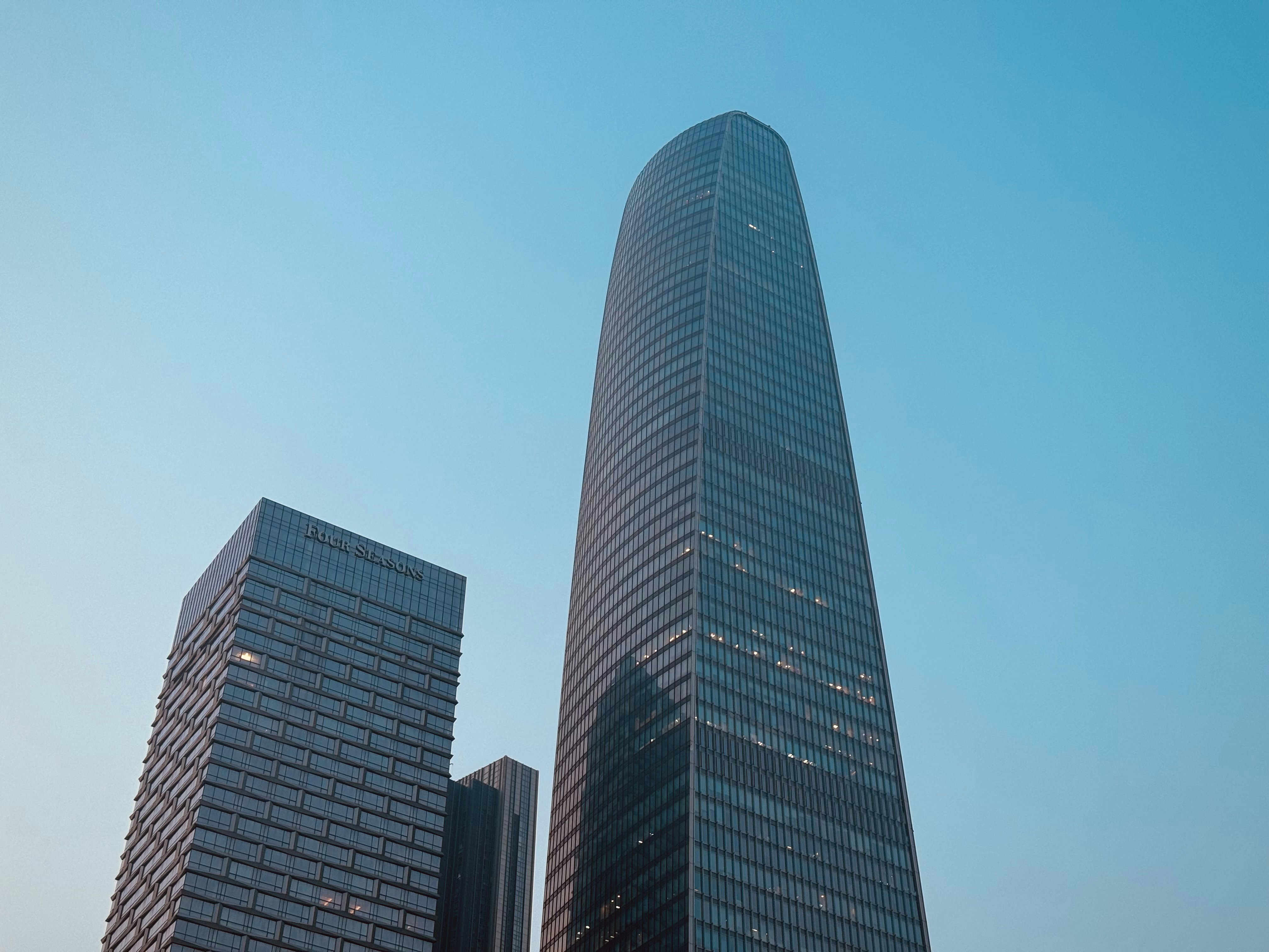 Two very tall buildings in a big city photo – Free City Image on Unsplash