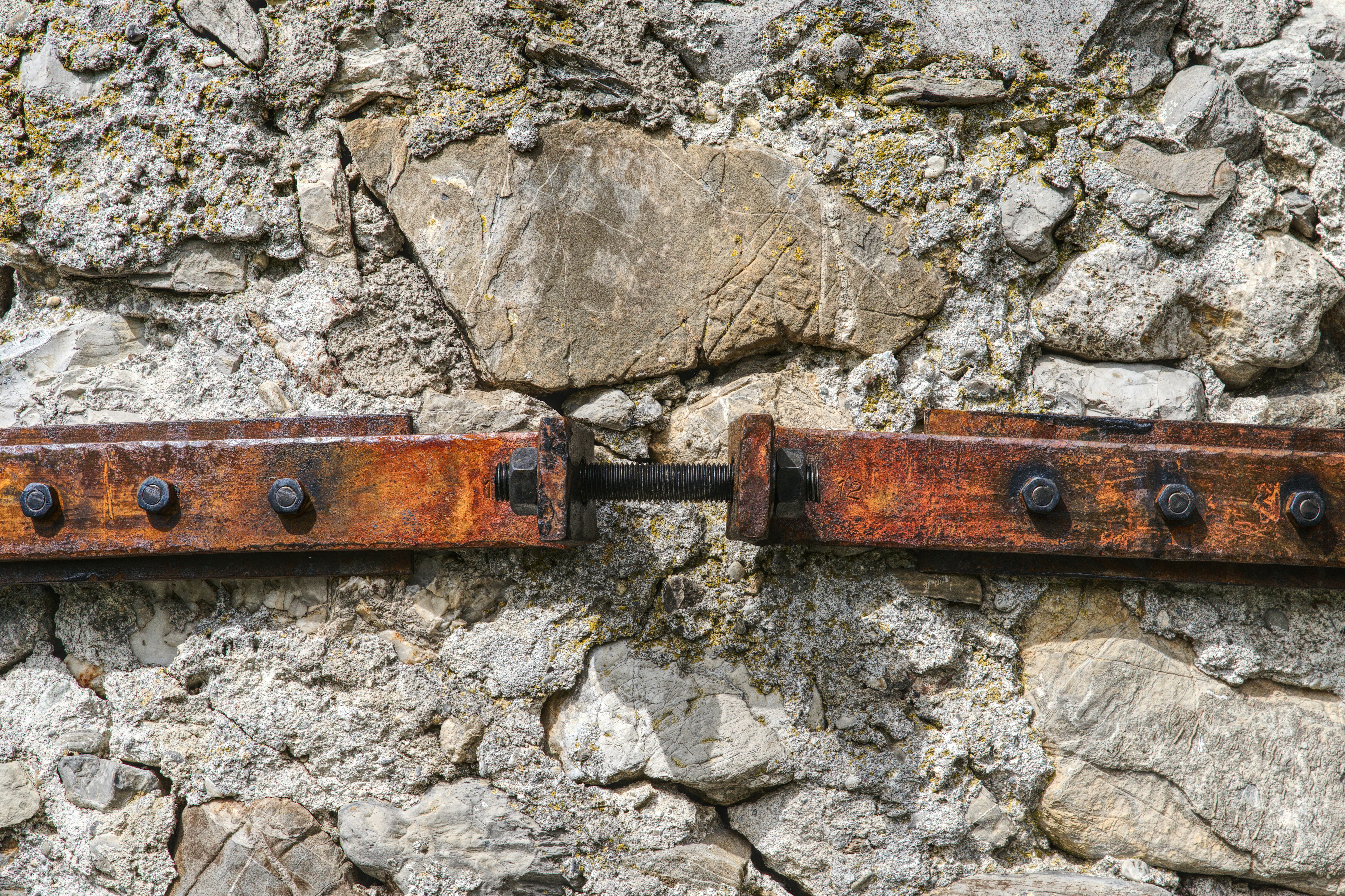 A rusted metal handle on a stone wall photo – Free Maienfeld Image on ...