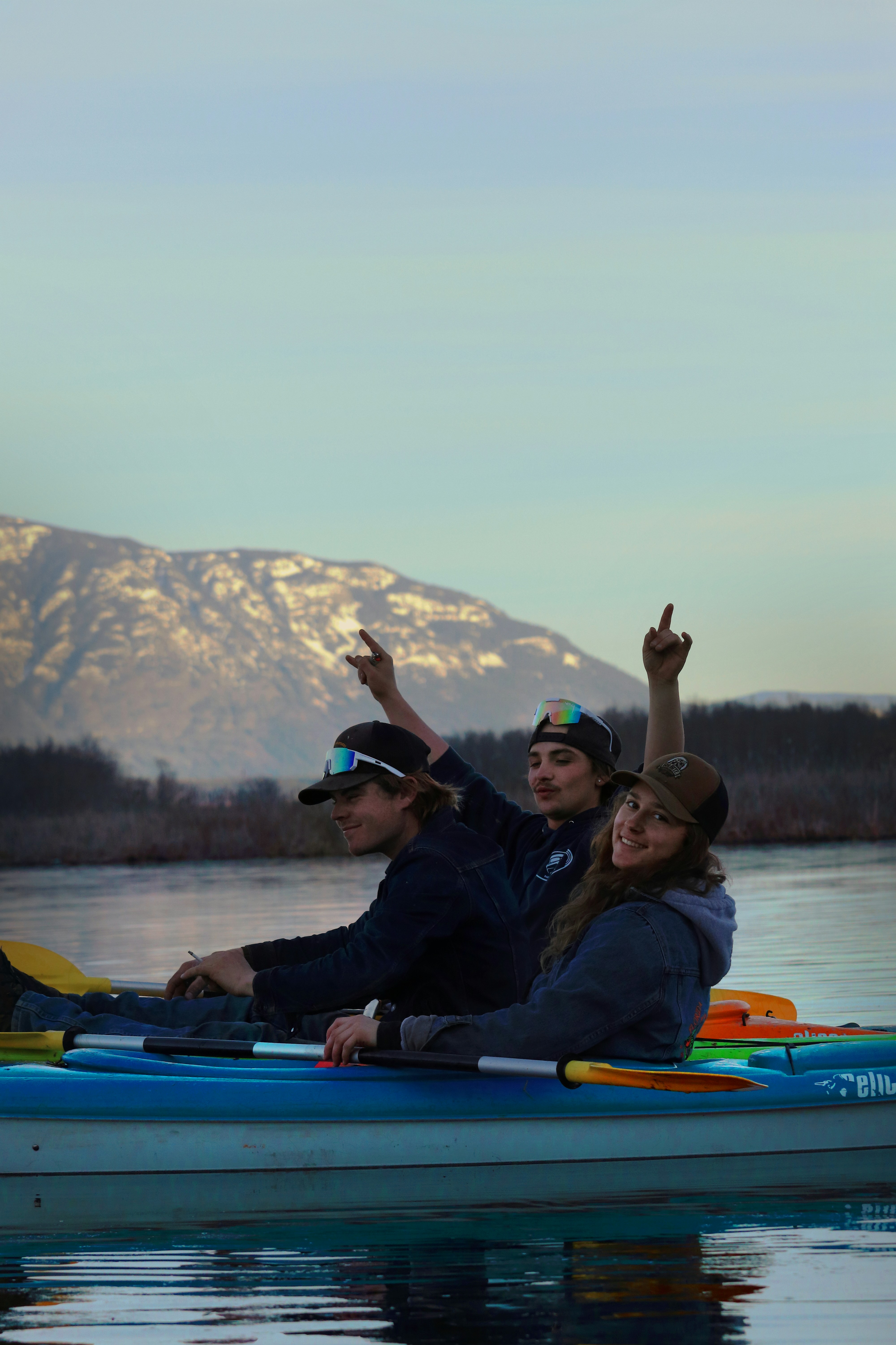 A group of people riding on the back of a kayak photo – Free Woman ...