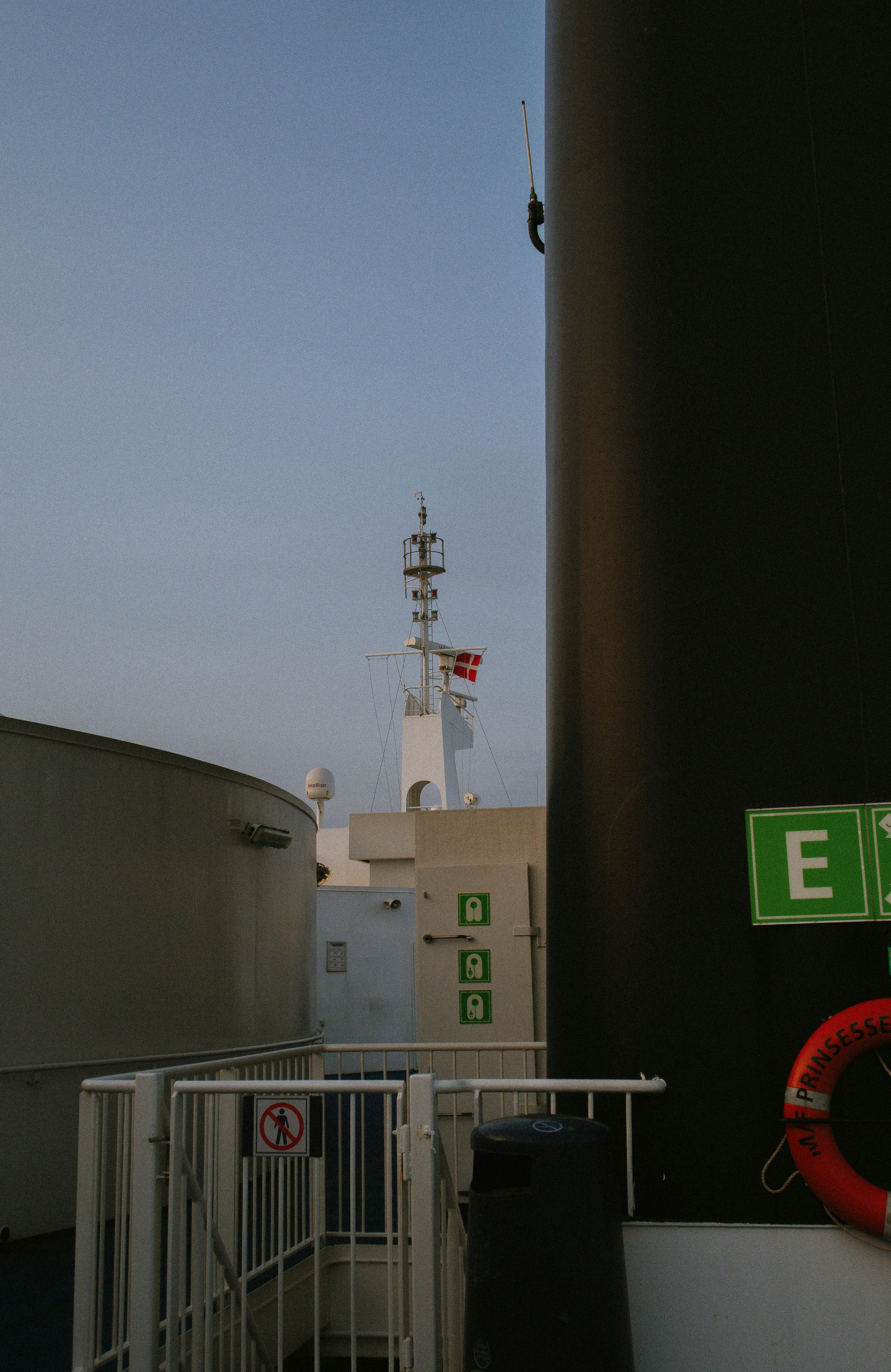 Flag at the Mast: Nordic Emblem Rising Above a Ship's Clean Geometry
