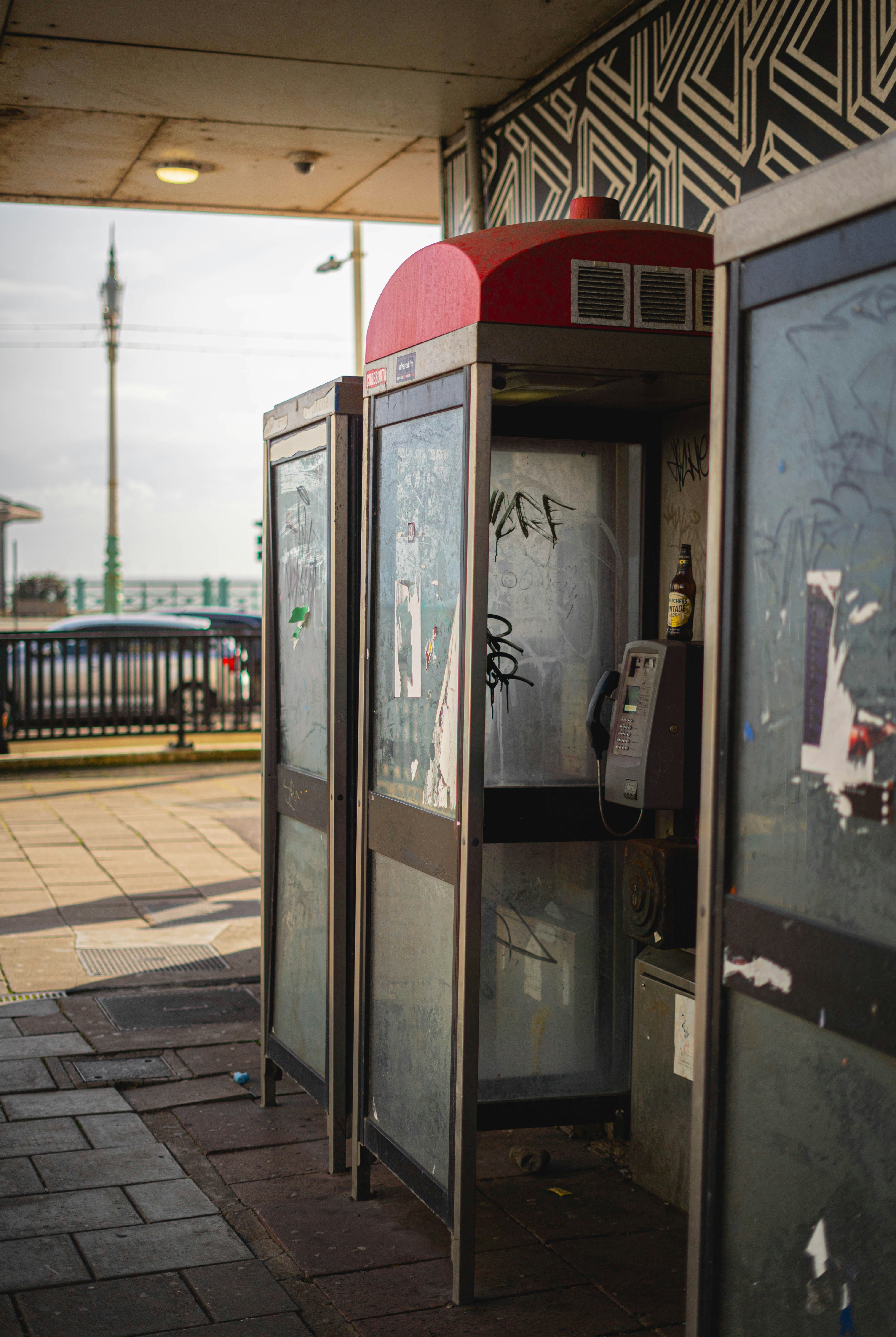 A public phone booth with graffiti on it photo – Free Brighton Image on ...