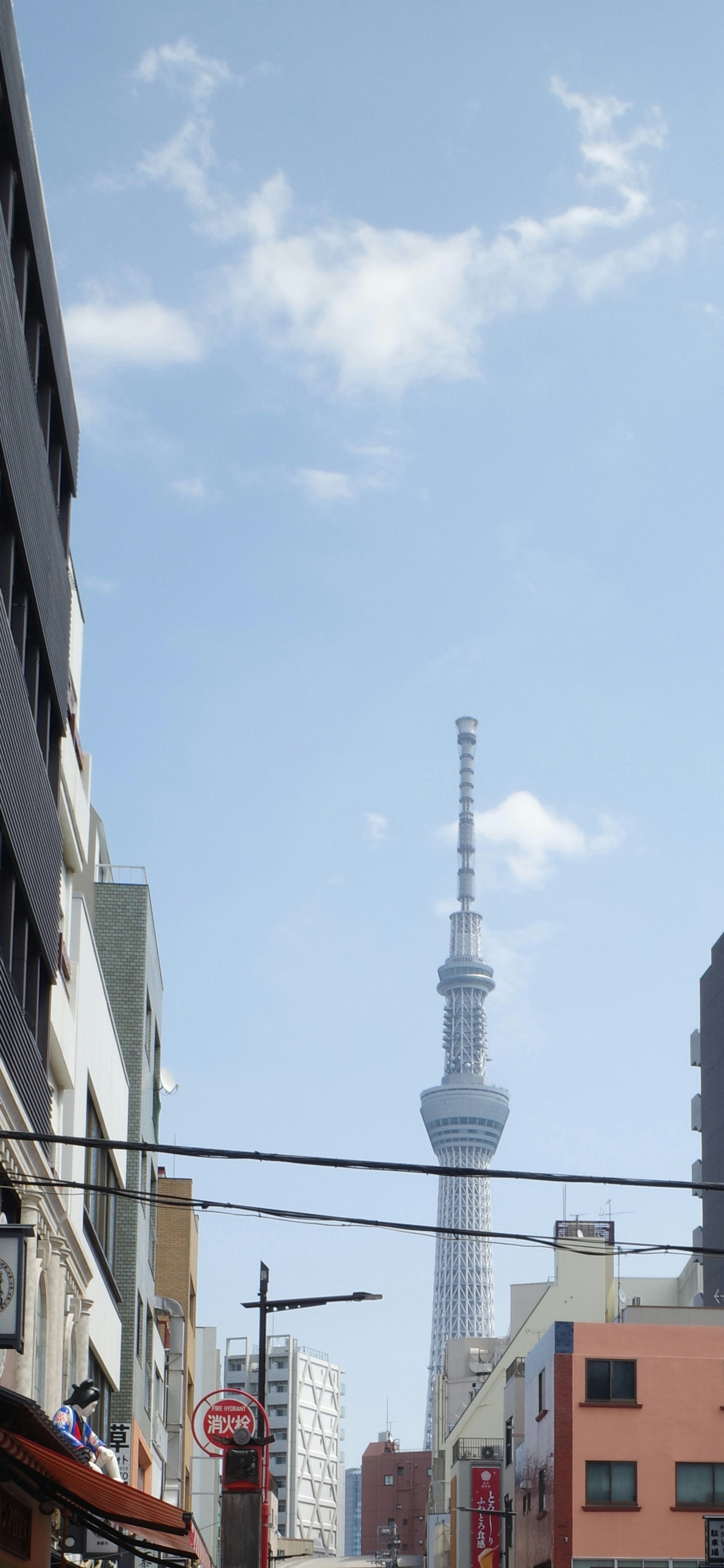 A tall tower towering over a city filled with tall buildings photo ...