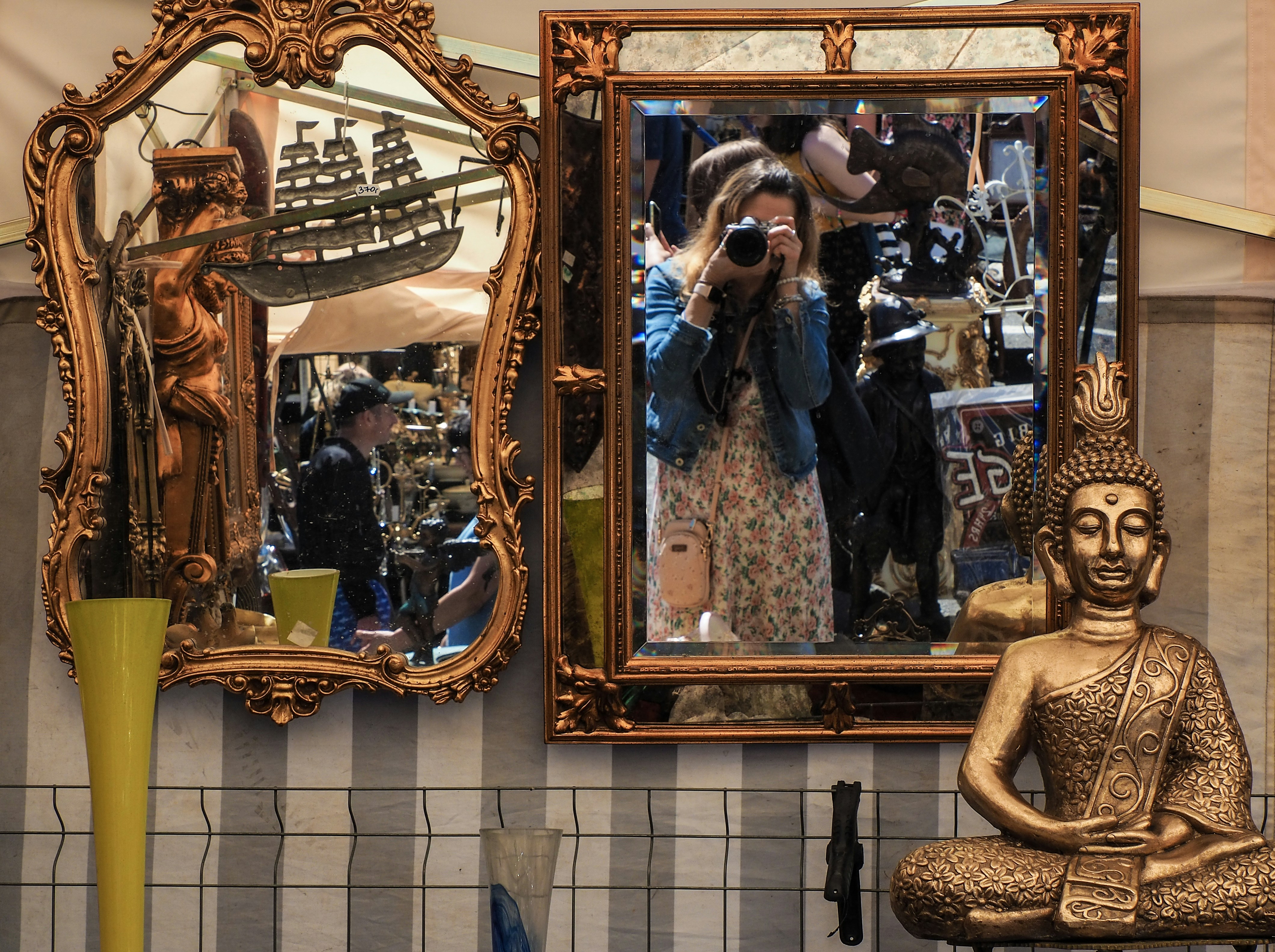 Reflections in Ornate Glass: A Quiet Studio of Mirrors and Buddha