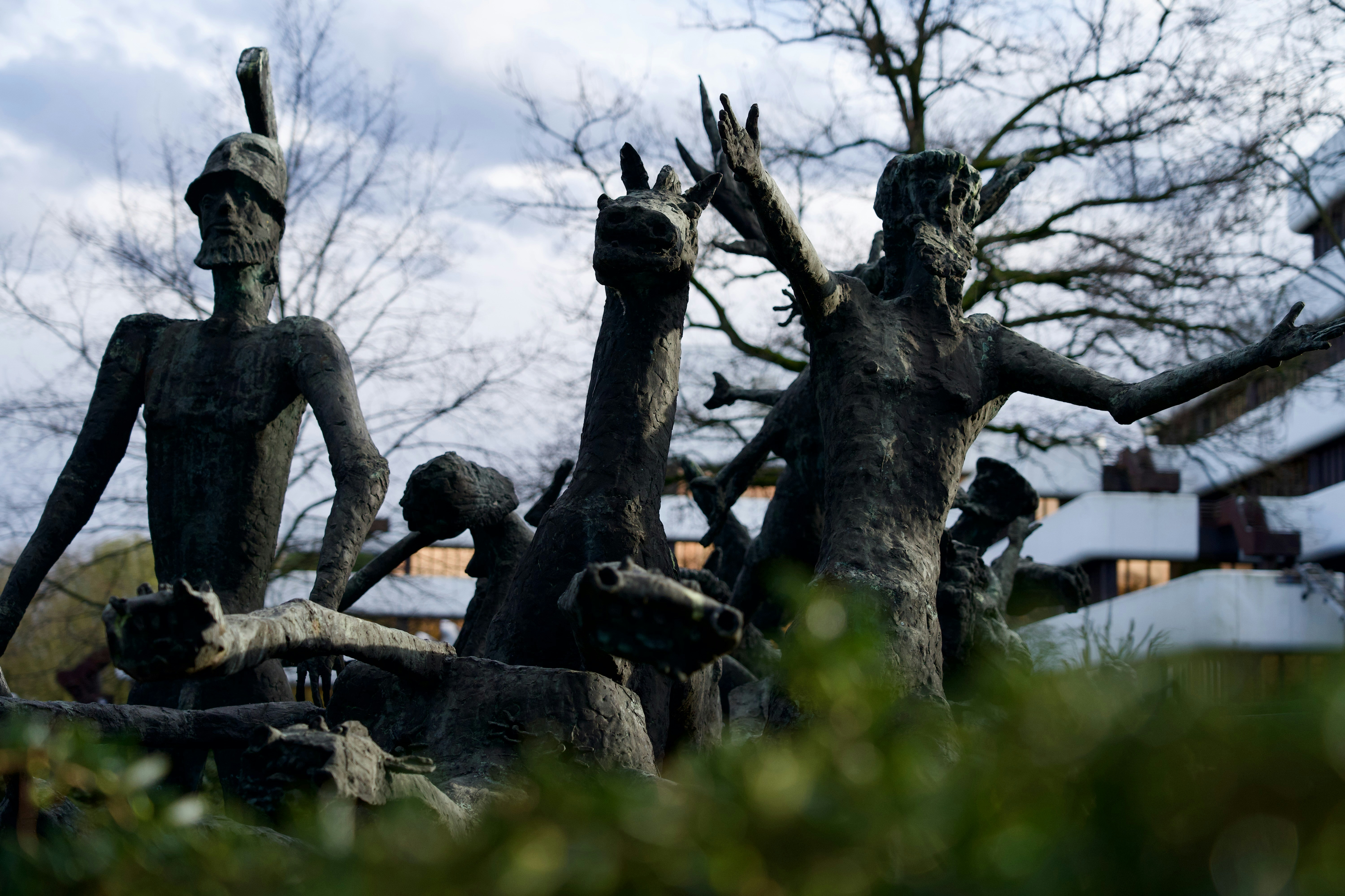 A group of statues sitting in the middle of a park photo – Free Travel ...